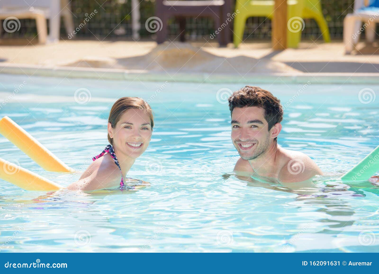 Couple In Swimming Pool Using Floats Stock Image Image Of Novice Float 162091631