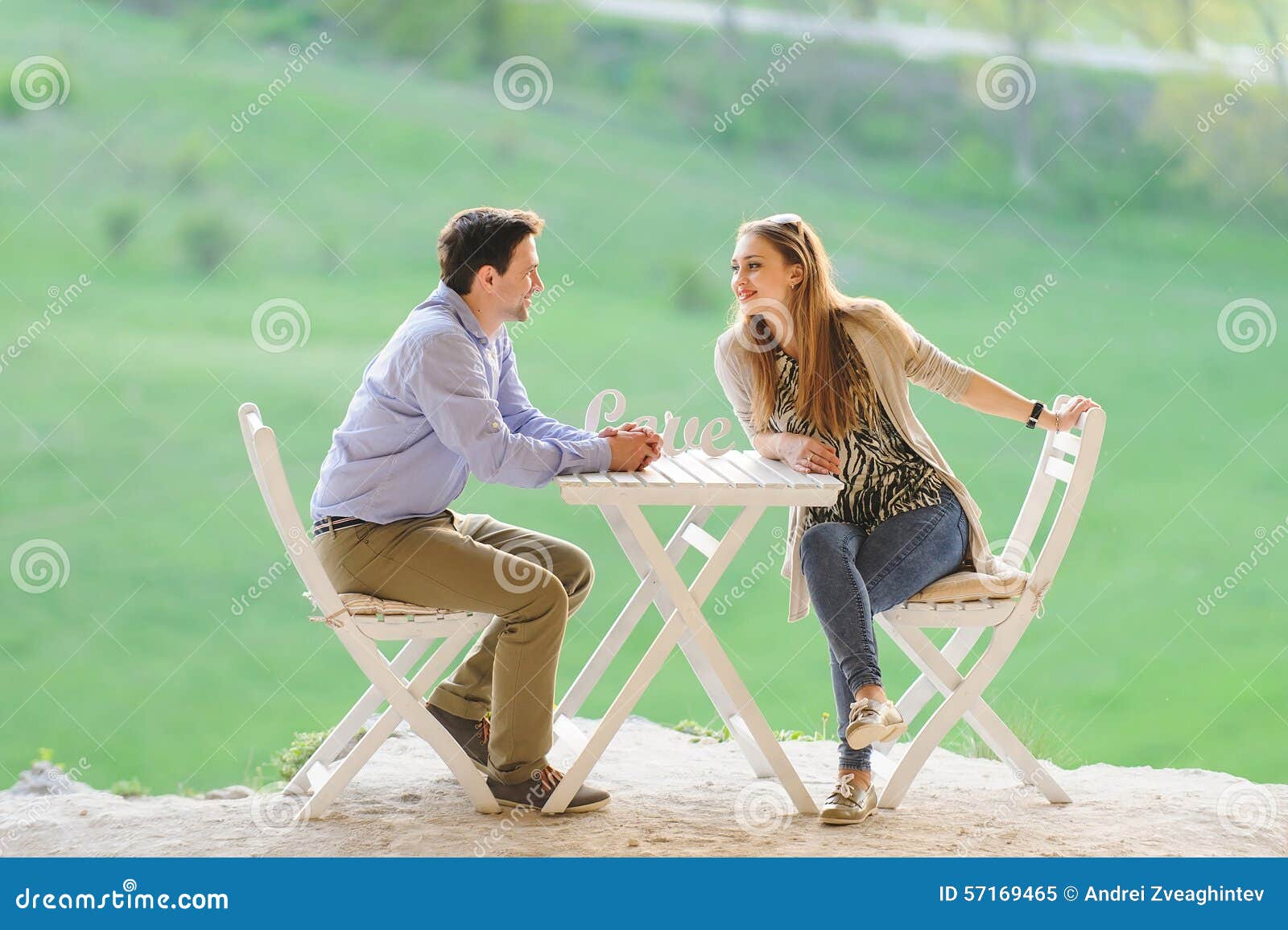 Couple at Table stock image. Image of girlfriend, outdoors - 57169465