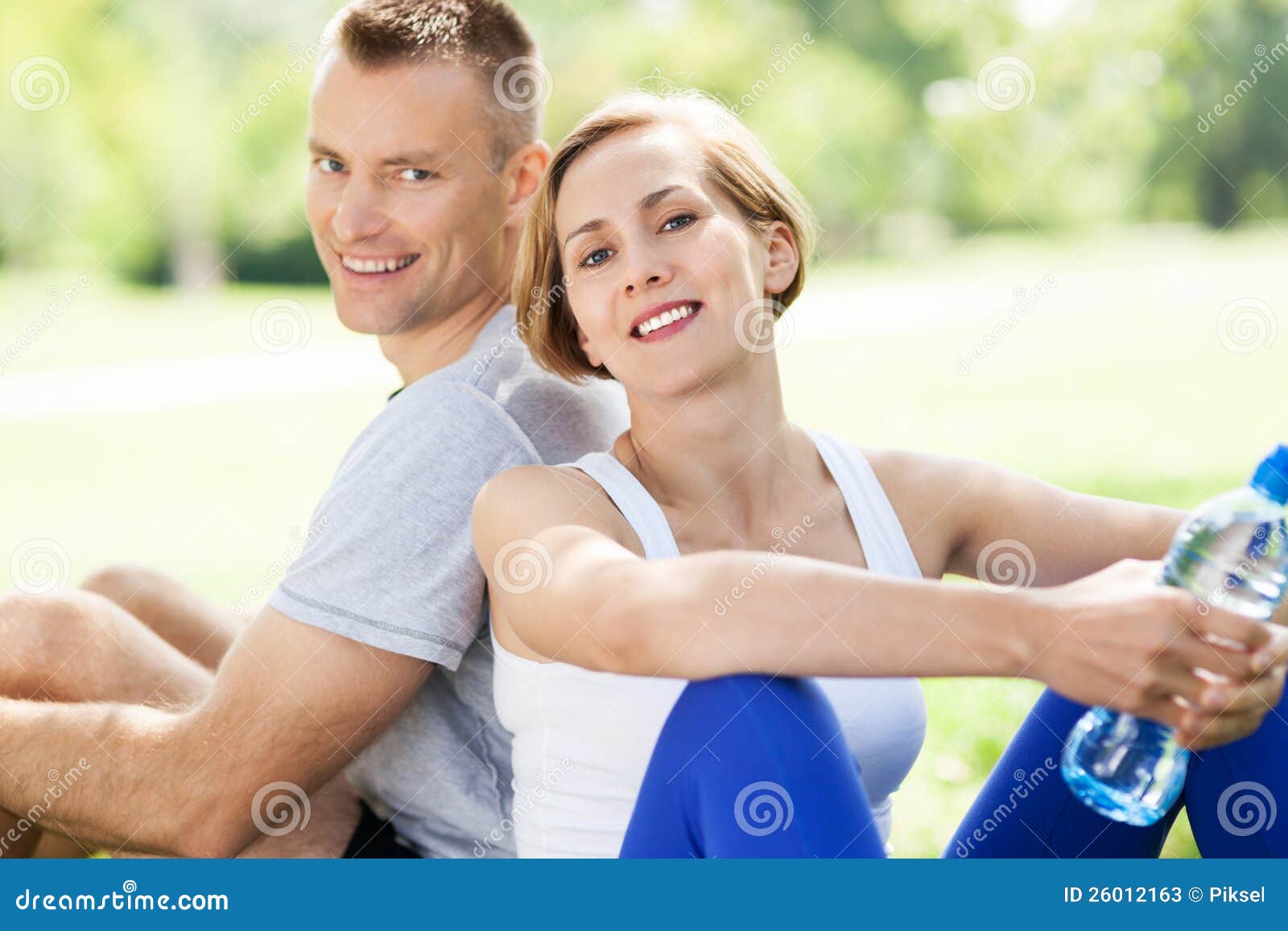 Couple Taking a Break from Exercises Stock Image - Image of bottle ...