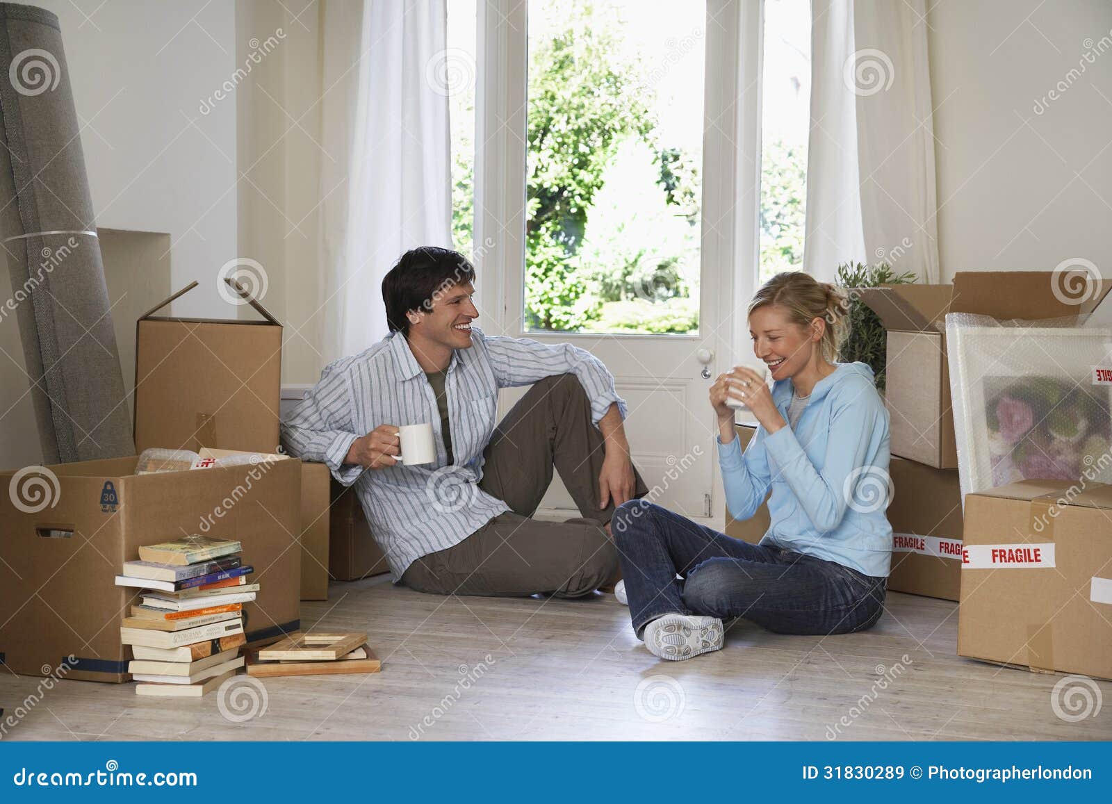 Couple Taking a Break among Moving Boxes Stock Image - Image of ...