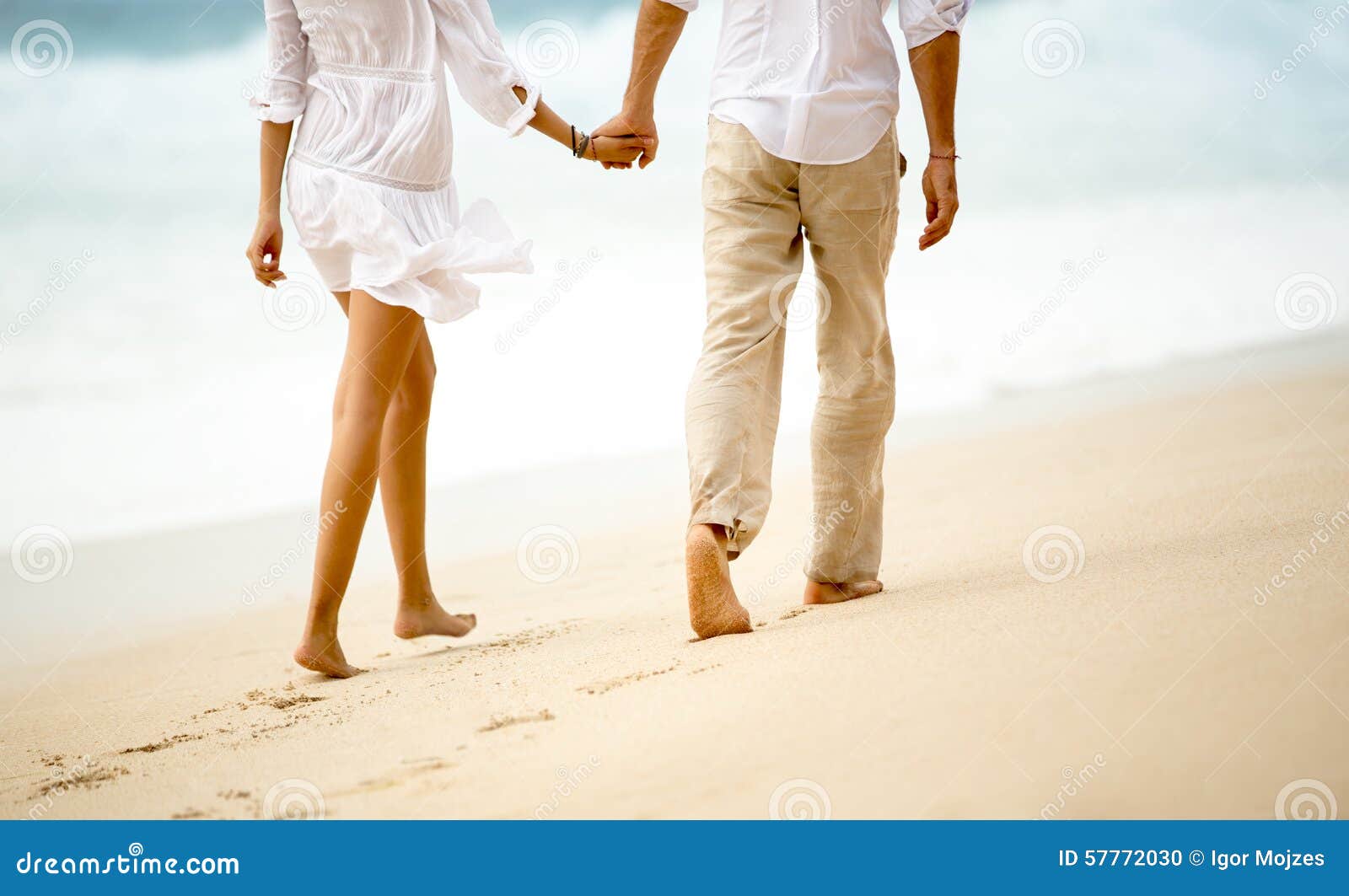 Couple Taking a Walk Holding Hands on the Beach Stock Photo - Image of ...