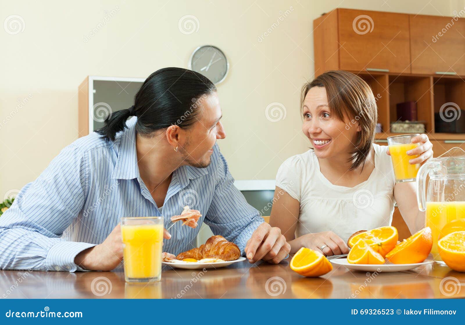 Couple Talking Over Breakfast at Home in Morning Stock Image - Image of ...