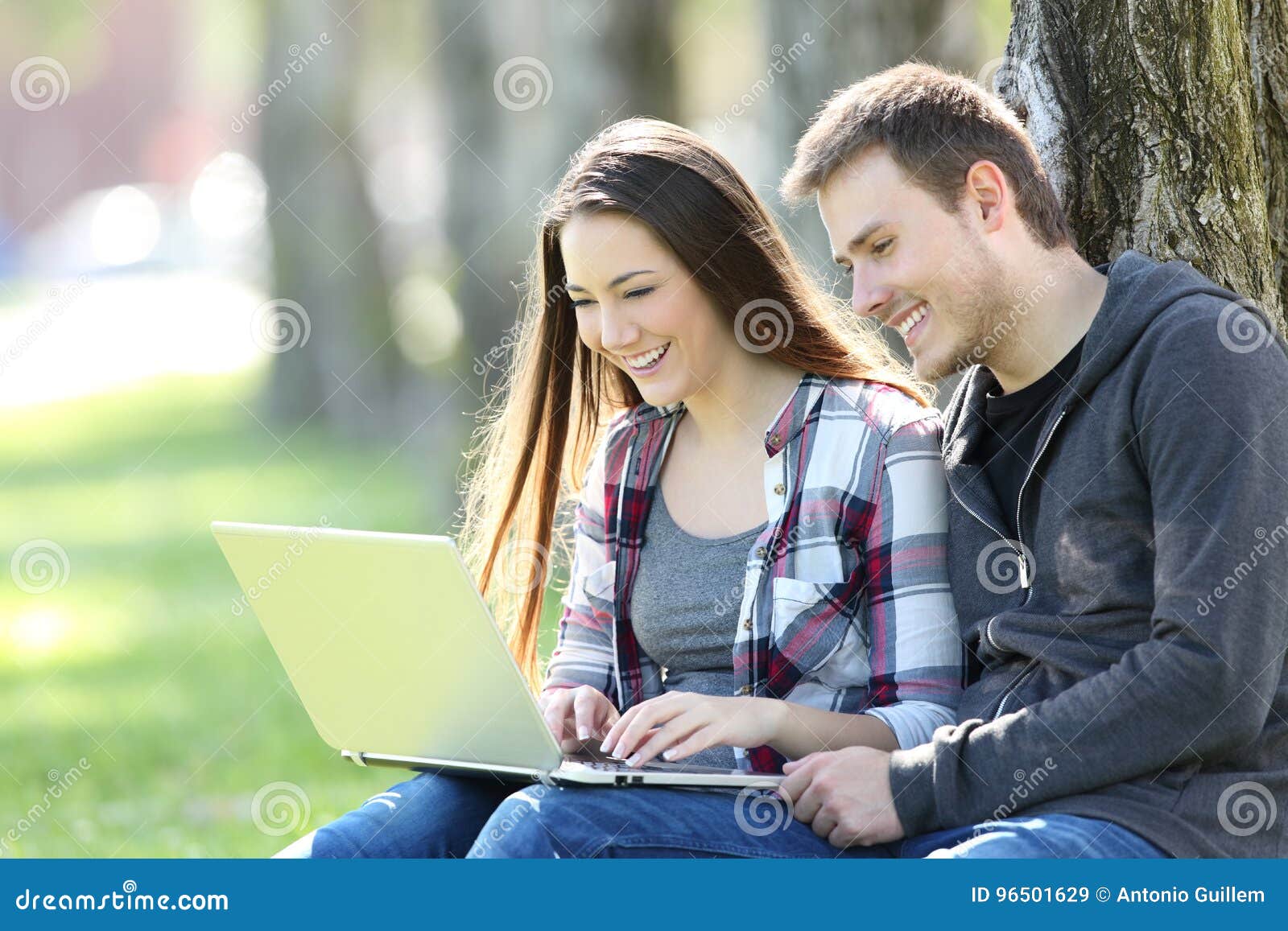 Couple of Teens Watching on Line Content Stock Image - Image of looking ...