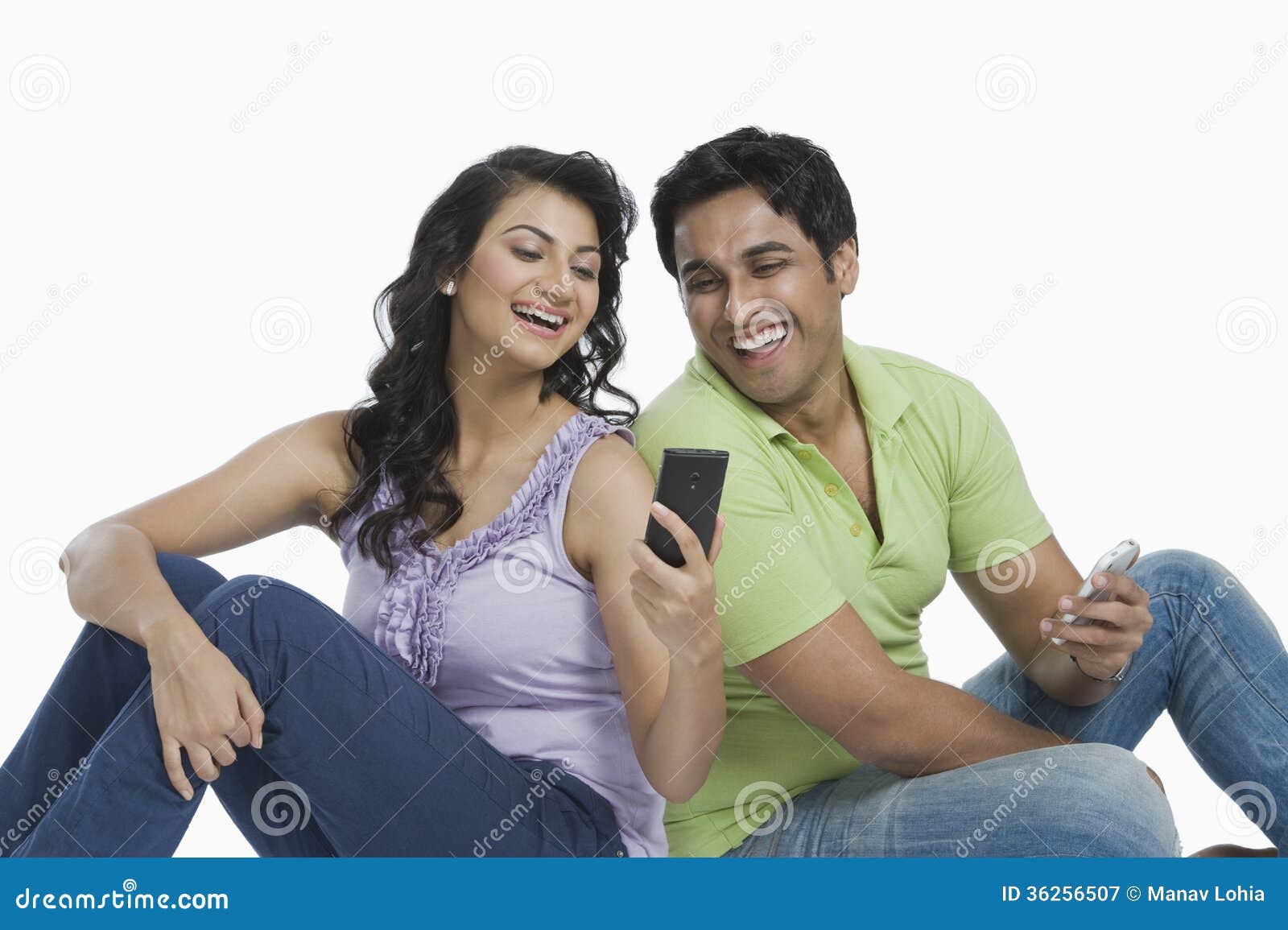 Couple Text Messaging on Mobile Phones Stock Image - Image of ethnicity ...