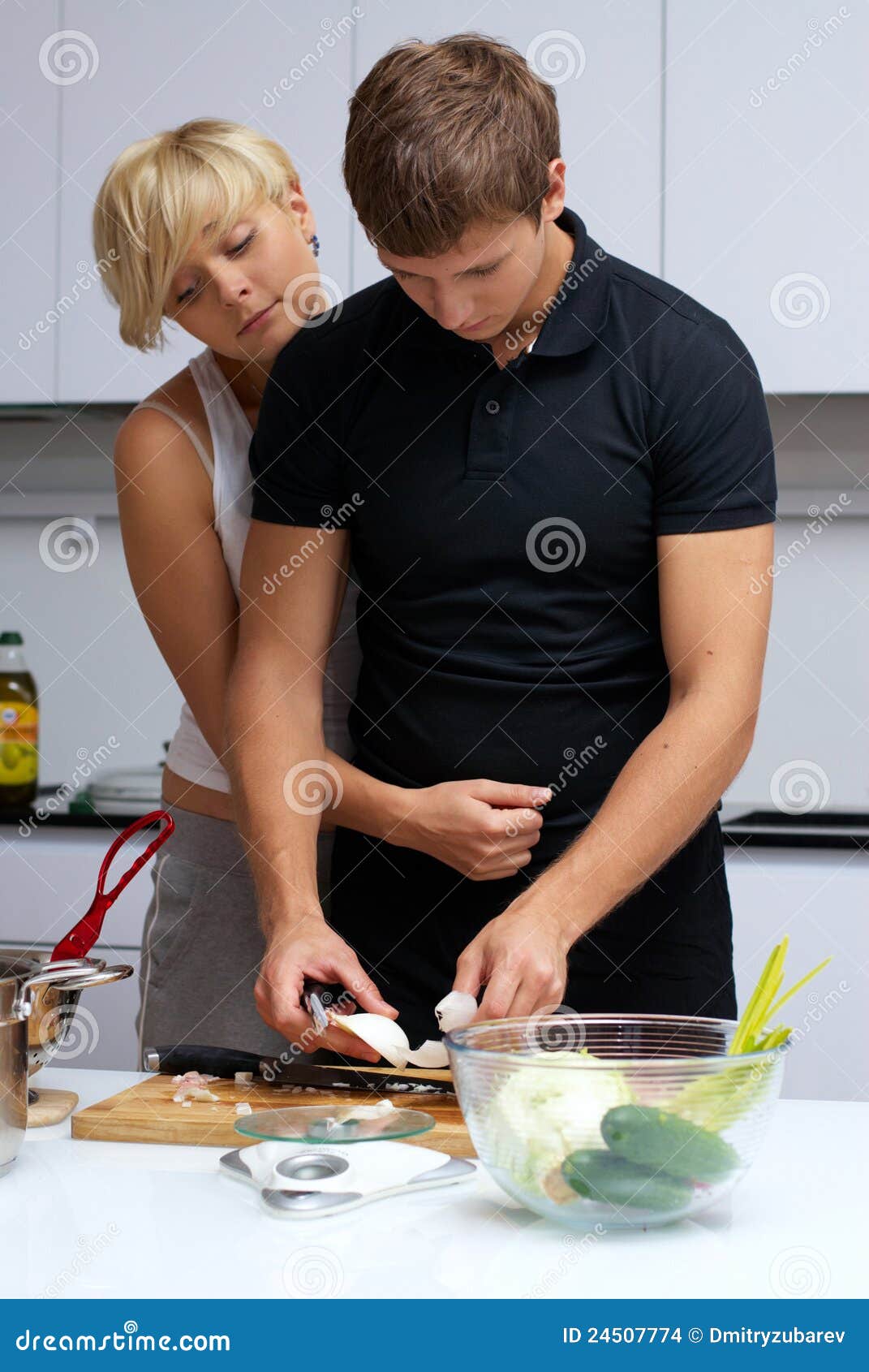 Couple in Their Kitchen Making Dinner Stock Photo - Image of couple ...