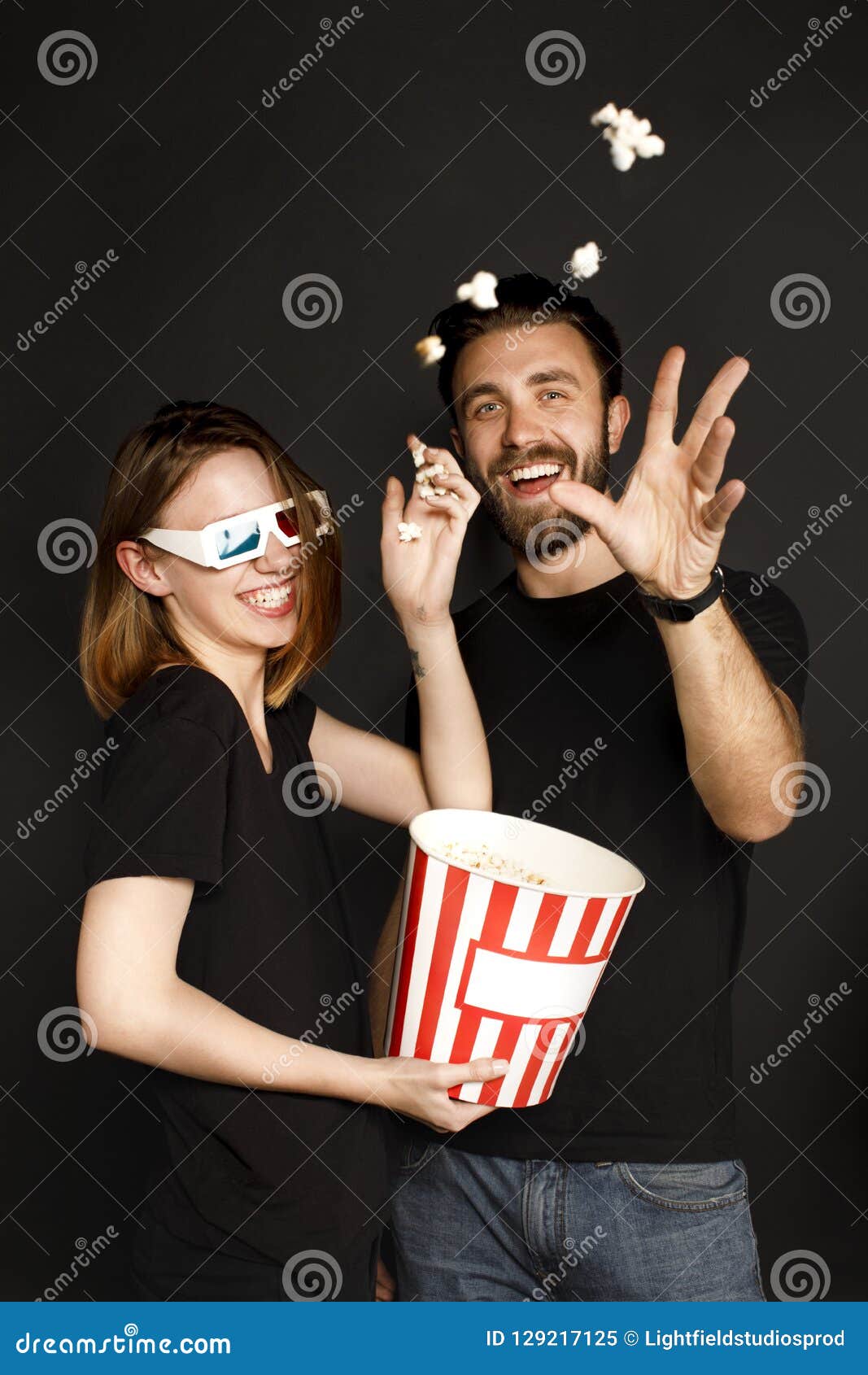 Couple Throwing Popcorn at Camera Stock Image - Image of food, smiling ...