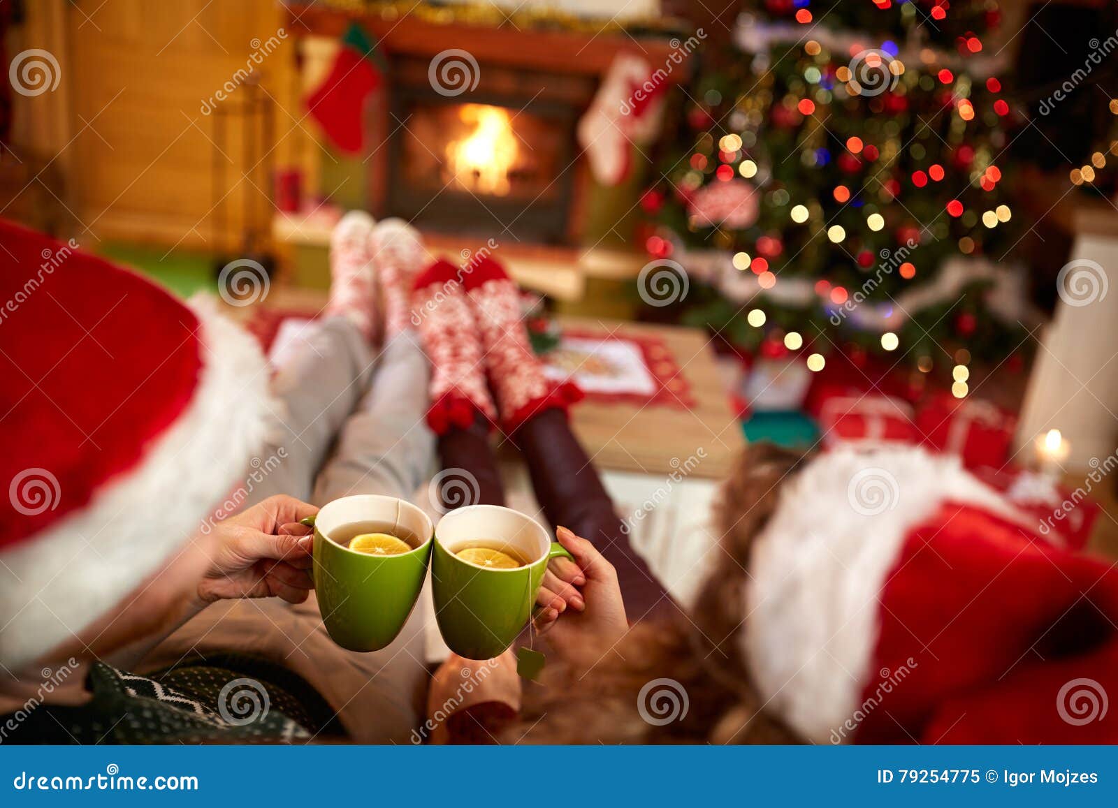 Couple Toasting with Coups of Tea Stock Image - Image of fire, back ...