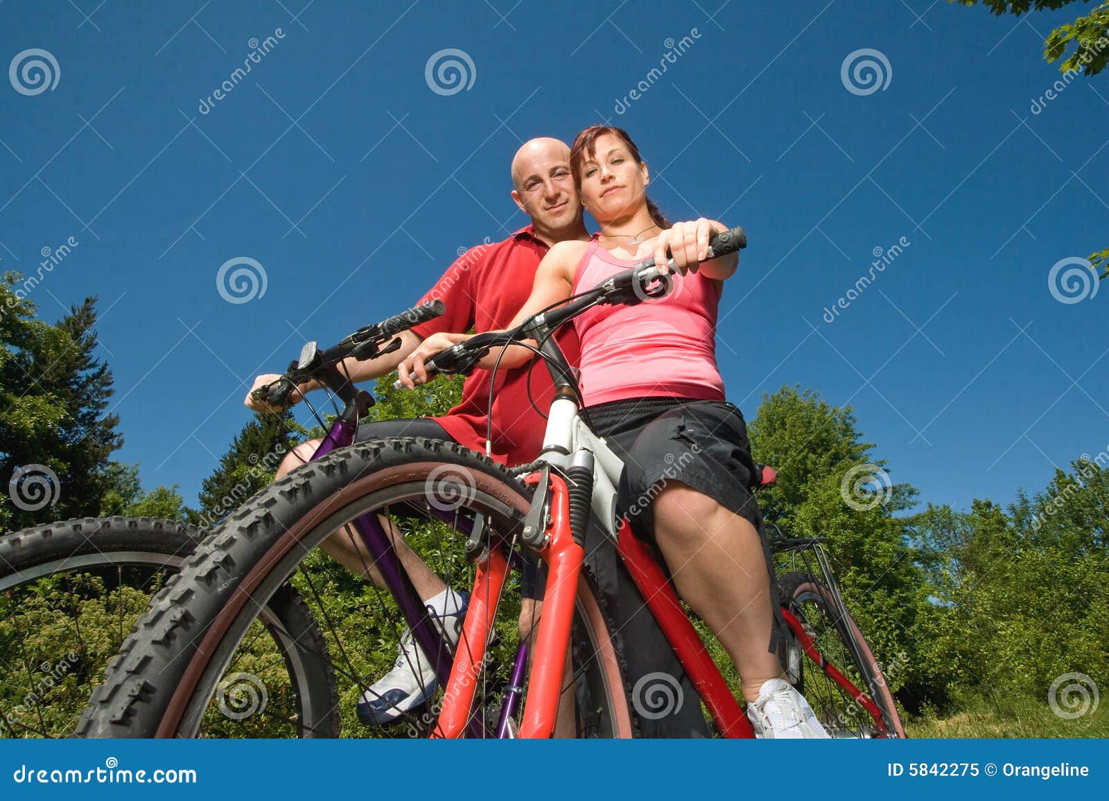 Couple Together on Bikes - Horizontal Stock Image - Image of seated ...