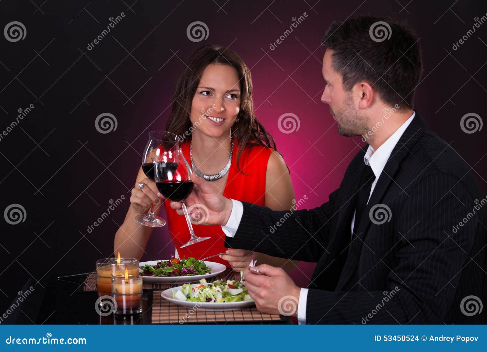Couple tossing wine glass stock photo. Image of gourmet - 53450524