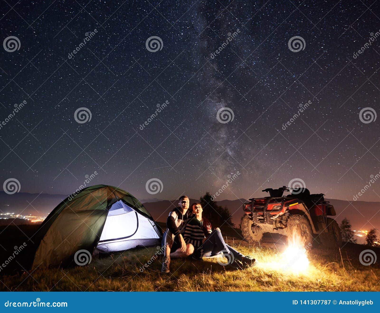 Couple Tourists With Atv Quad Bike Under Night Starry Sky Stock Image