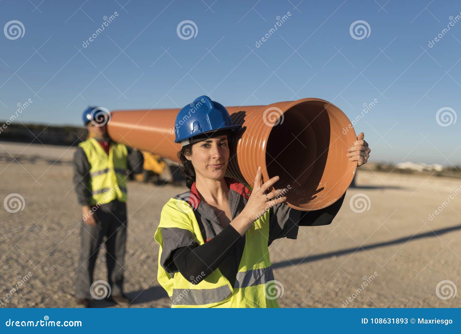 Â Couple of Workers Transports a Plastic Construction Pipe Work Stock ...