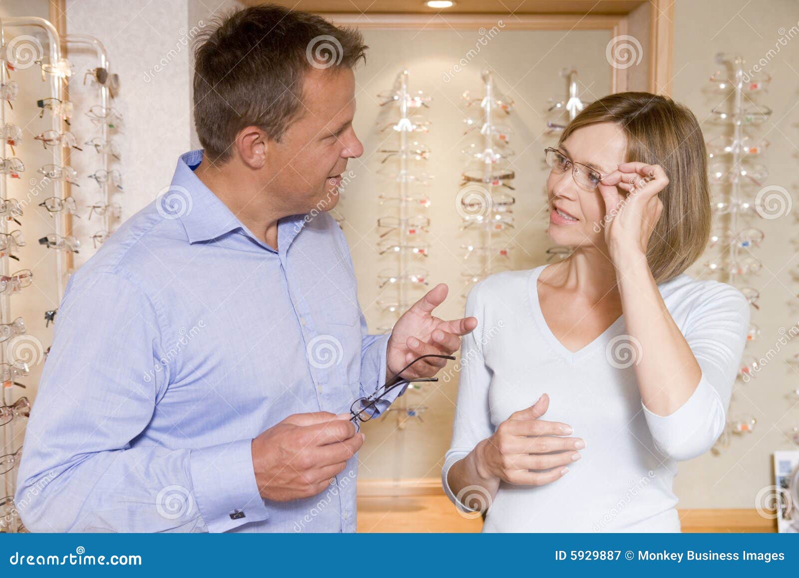 Couple Trying on Eyeglasses at Optometrists Stock Image - Image of male ...
