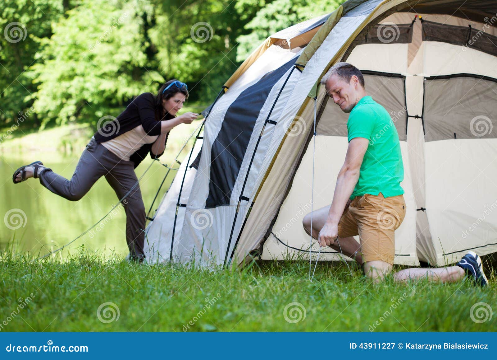 Couple Trying To Pitch a Tent Stock Image - Image of recreation, grass ...