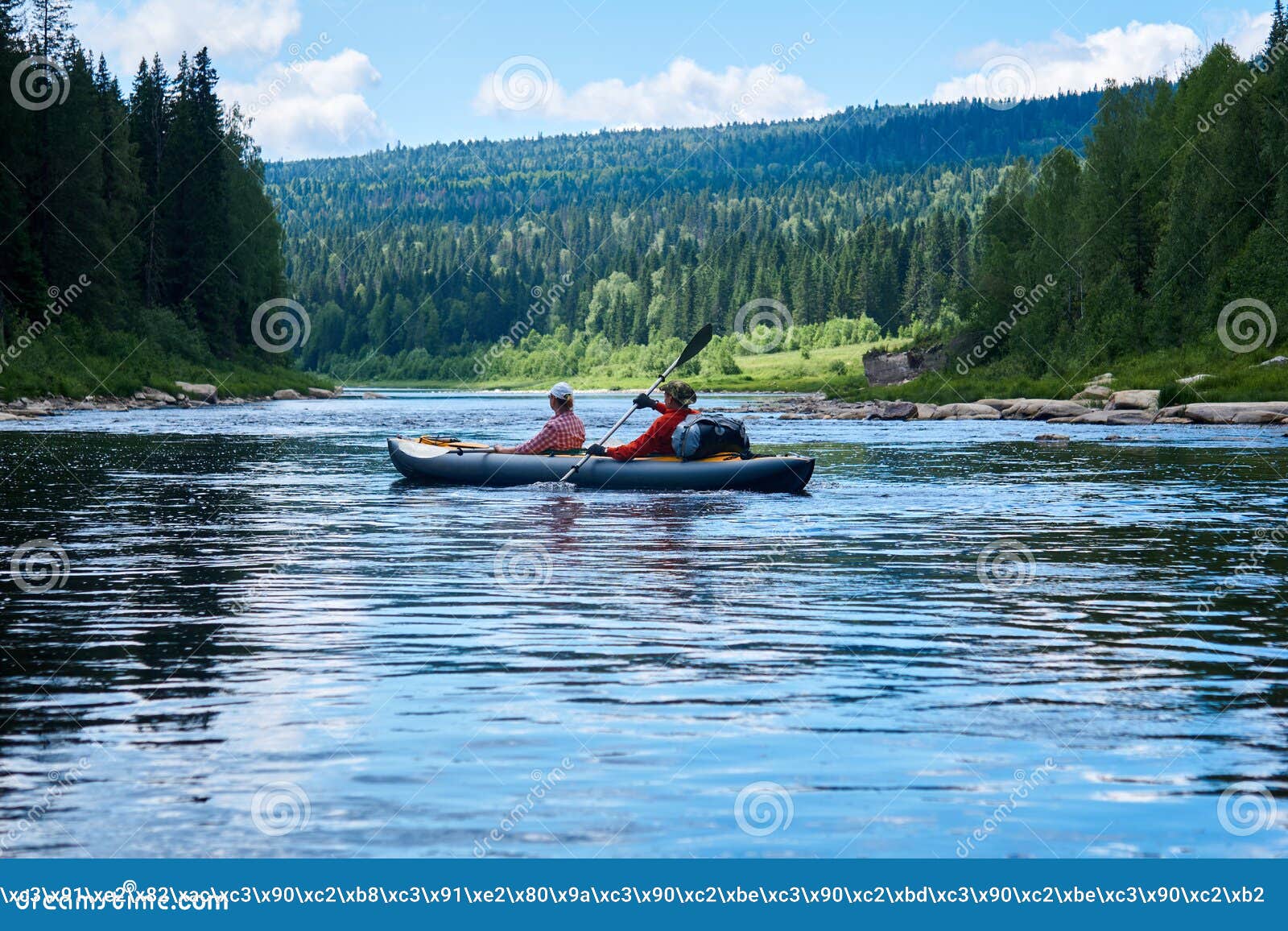Couple in a Two-seater Kayak Rafting Down the River among the Mountains ...