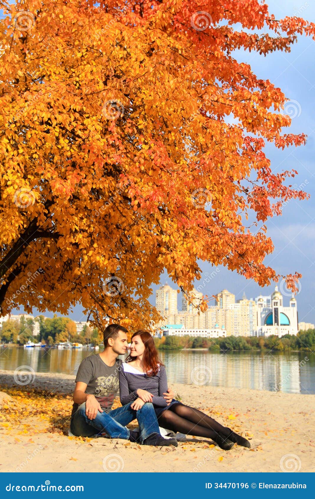 Couple Under Bright Orange Tree in Autumn Stock Photo - Image of love ...