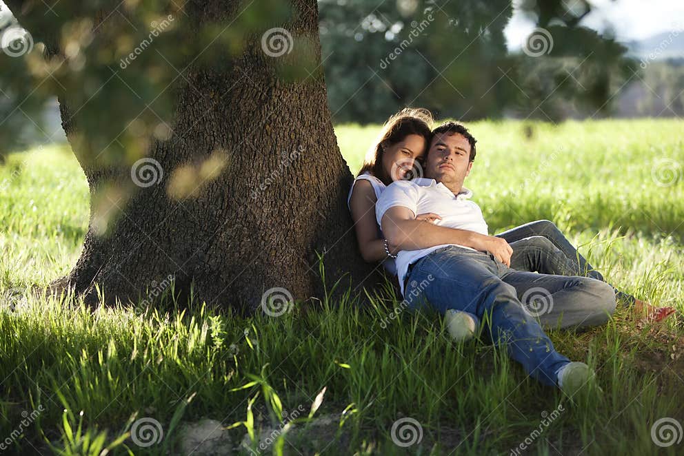Couple under tree stock photo. Image of resting, passion - 14727268