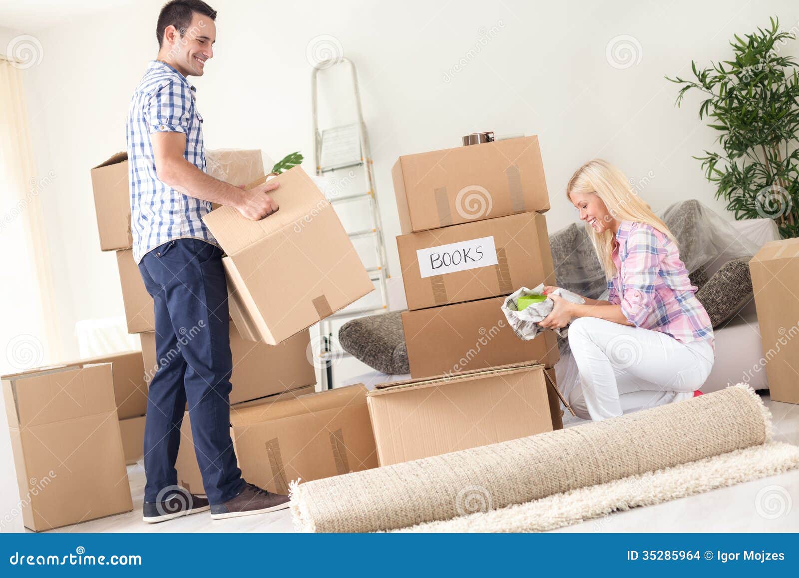 Couple Unpack Moving Boxes. Stock Photo - Image of cheerful, people ...