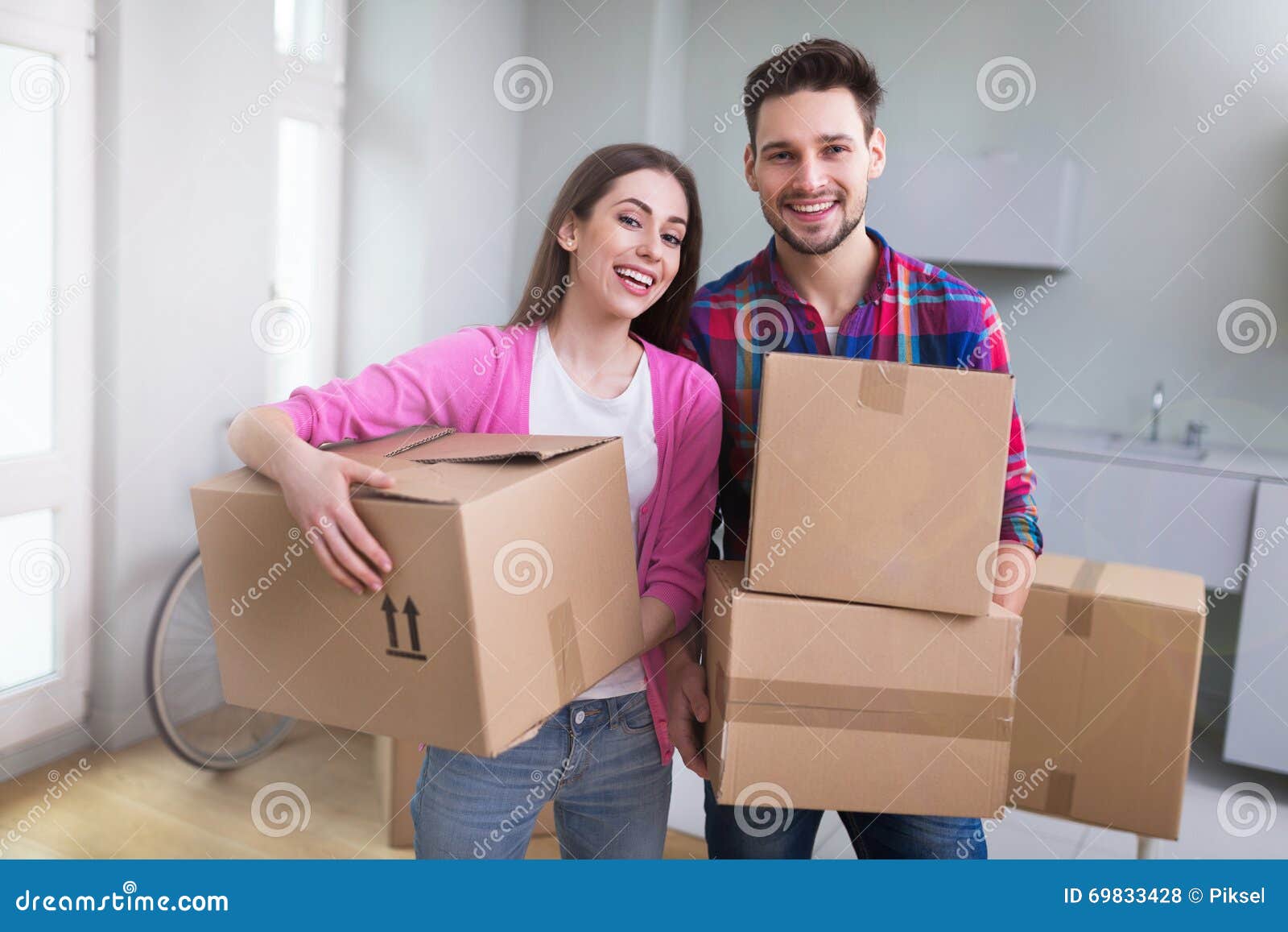 Couple with Unpacked Boxes in New Home Stock Photo - Image of carton ...