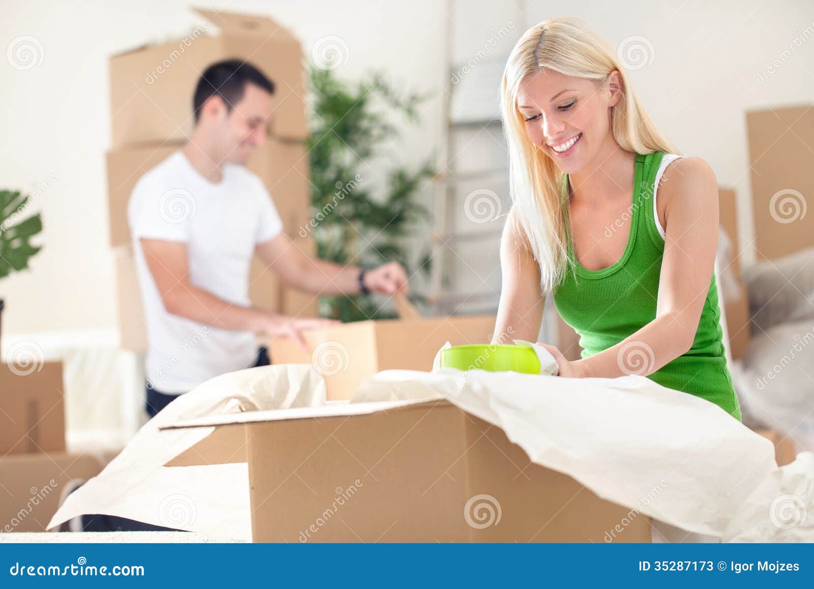Couple unpacking boxes stock image. Image of adult, horizontal - 35287173
