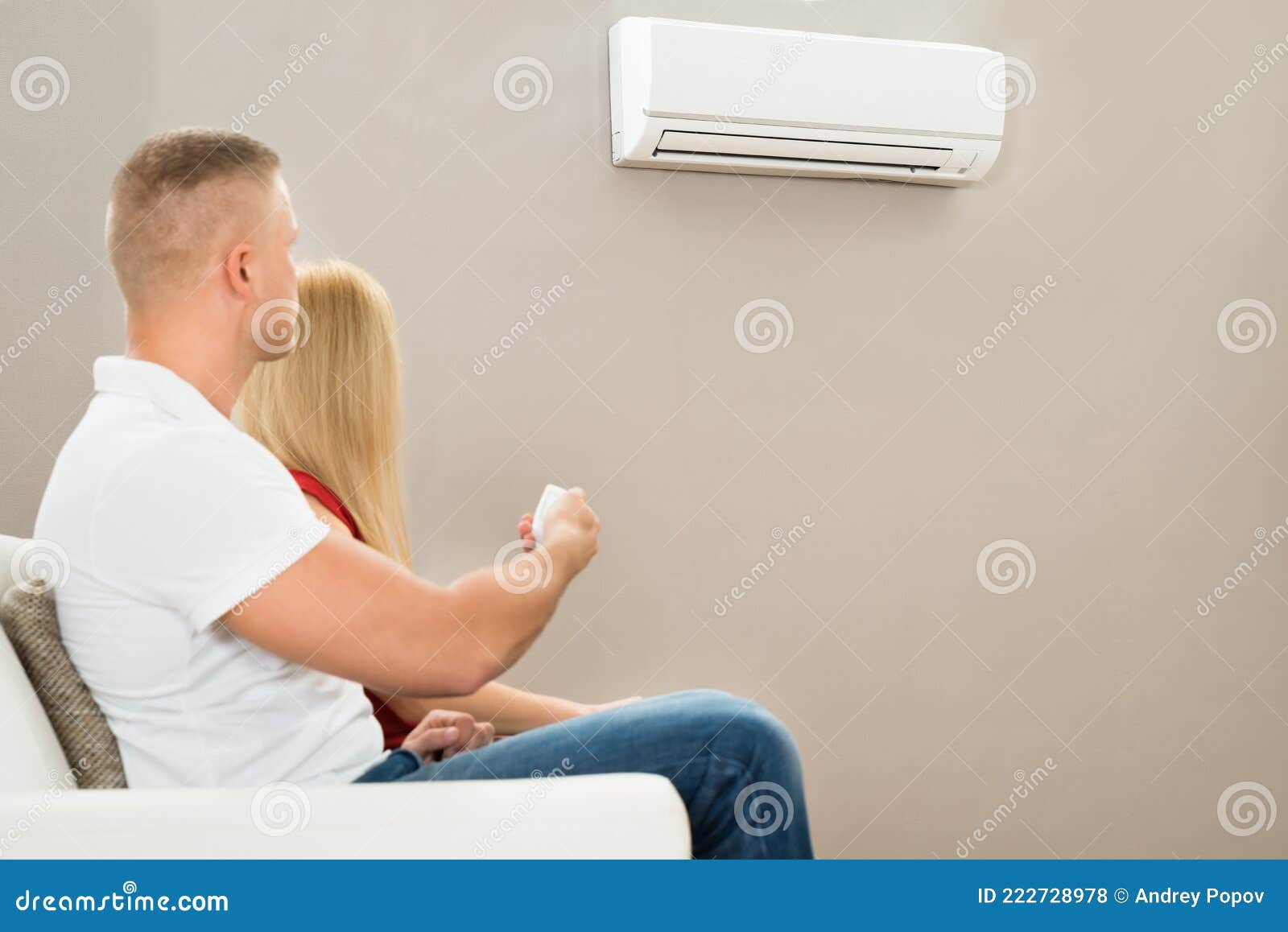 Couple Using Air Conditioner Stock Photo - Image of home, appliance ...