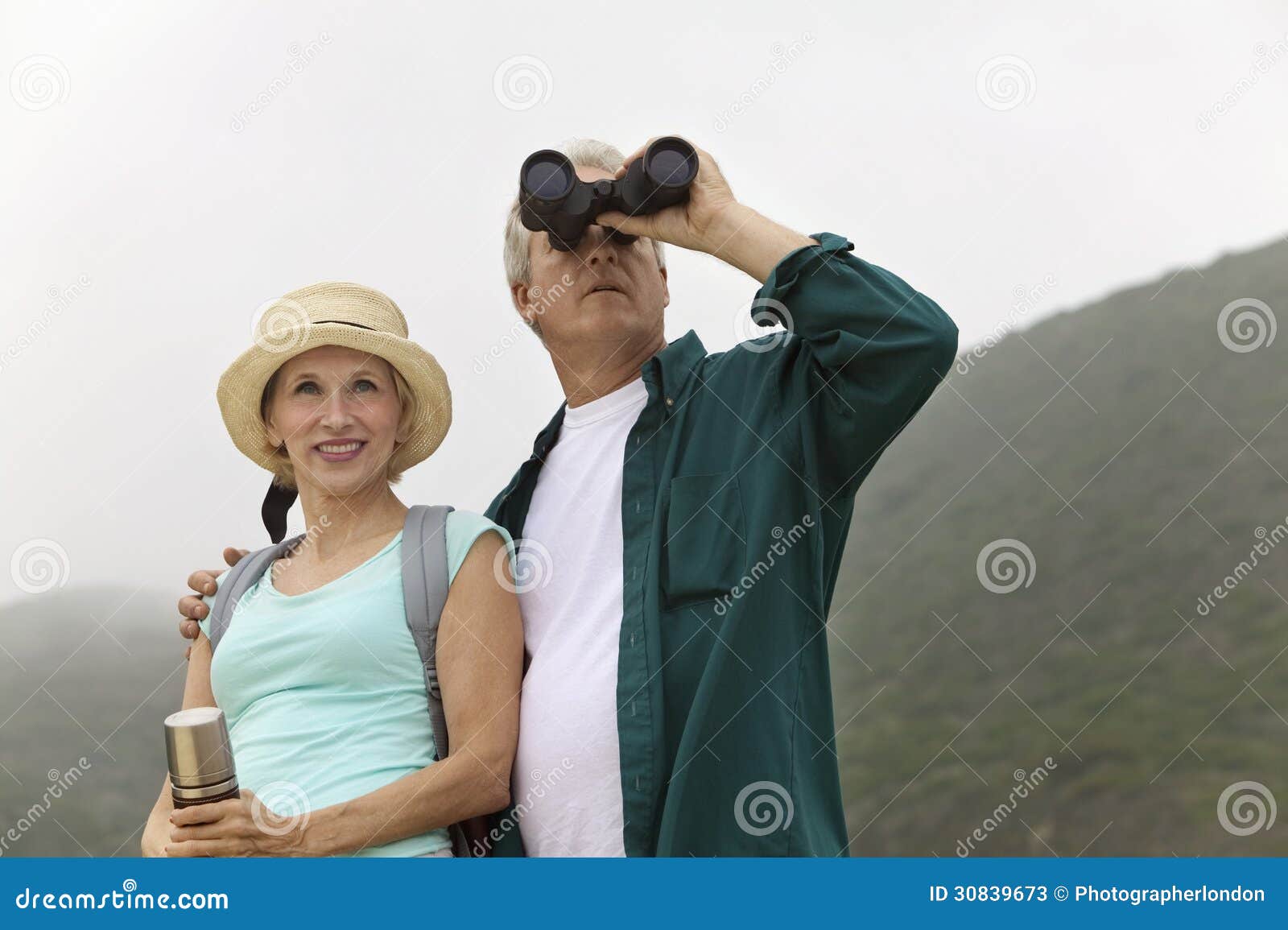 Couple Using Binoculars in Countryside Stock Image - Image of palm ...