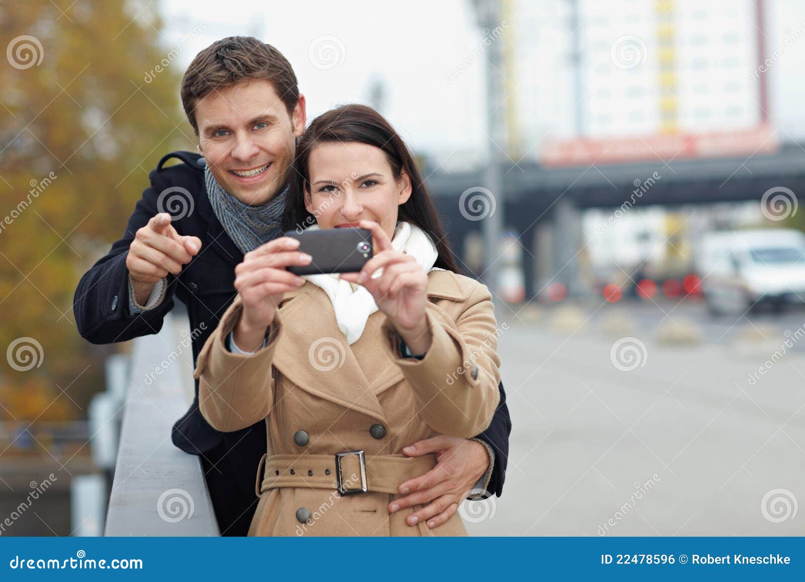 Couple Using Camera in Mobile Phone Stock Photo - Image of show, fall ...