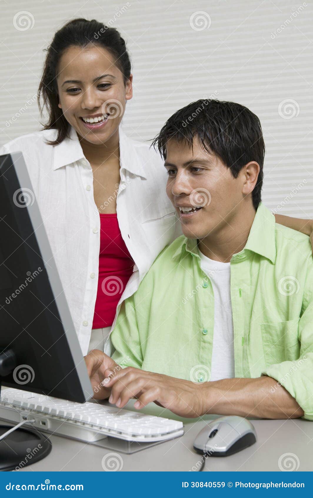 Couple Using Computer at Desk Stock Image - Image of computer, short ...