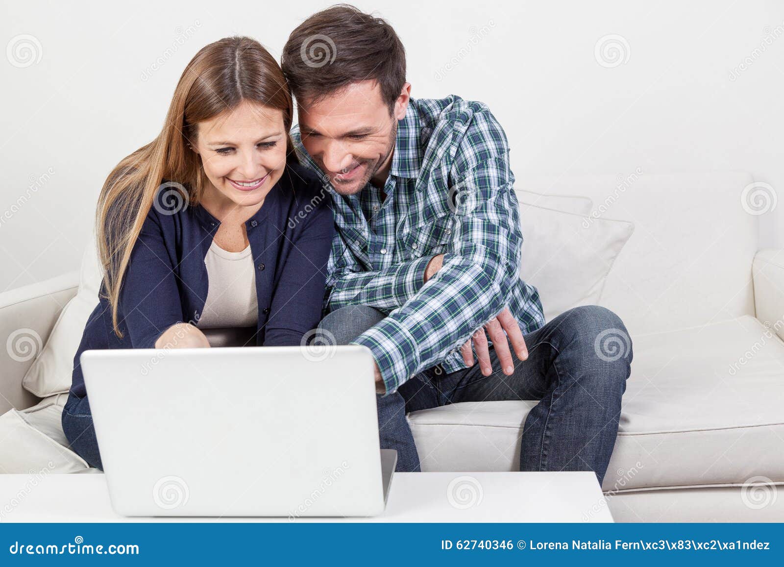 Couple using the computer stock photo. Image of years - 62740346