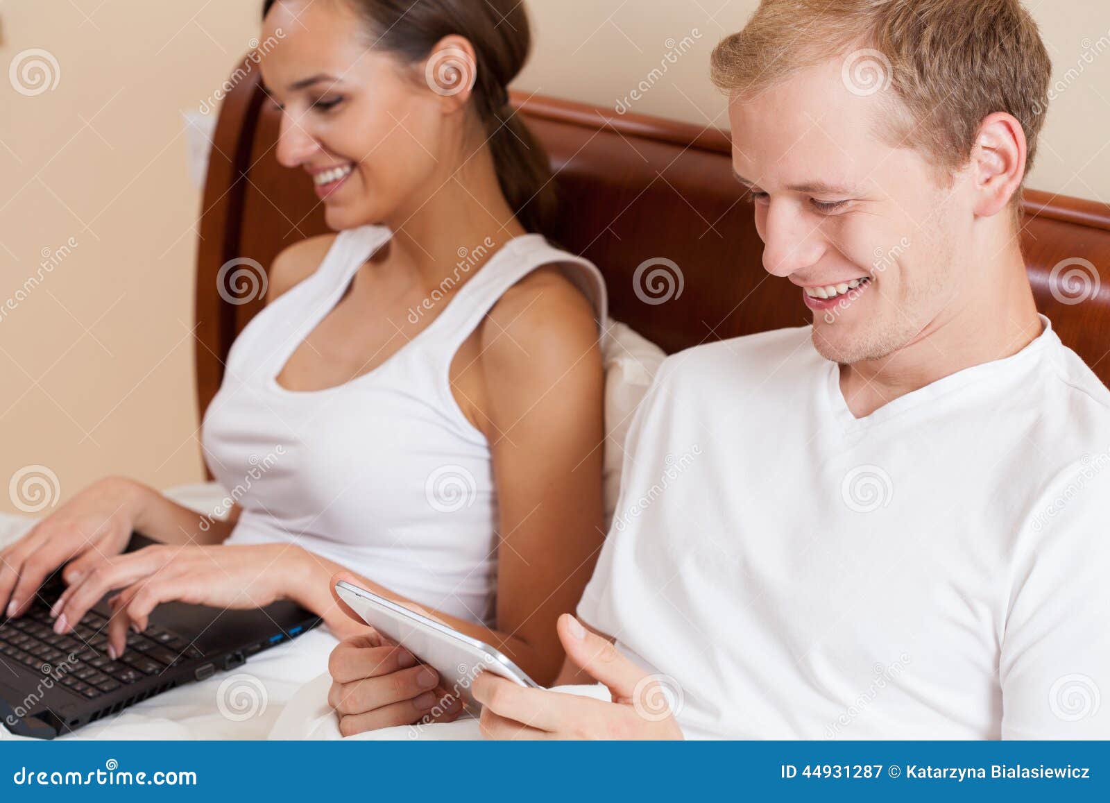 Couple Using Internet in Bed Stock Image - Image of husband, relaxation ...