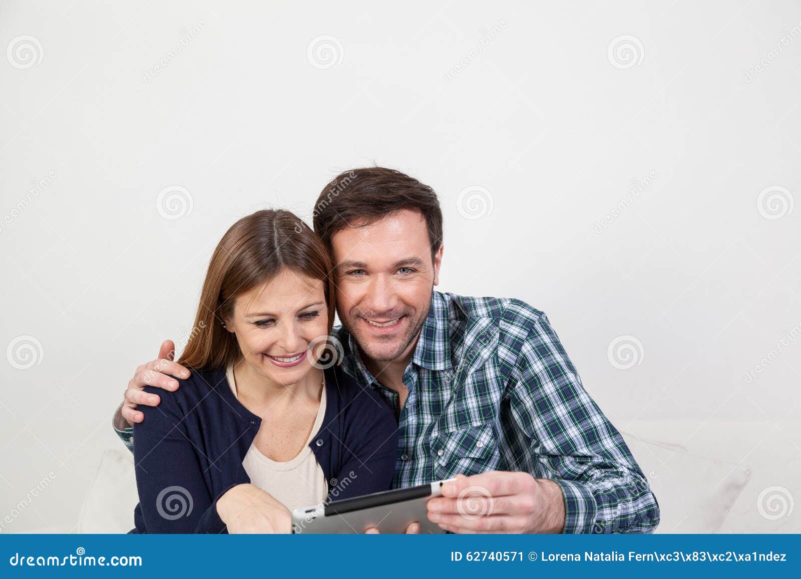 Couple using the ipad stock image. Image of computer - 62740571