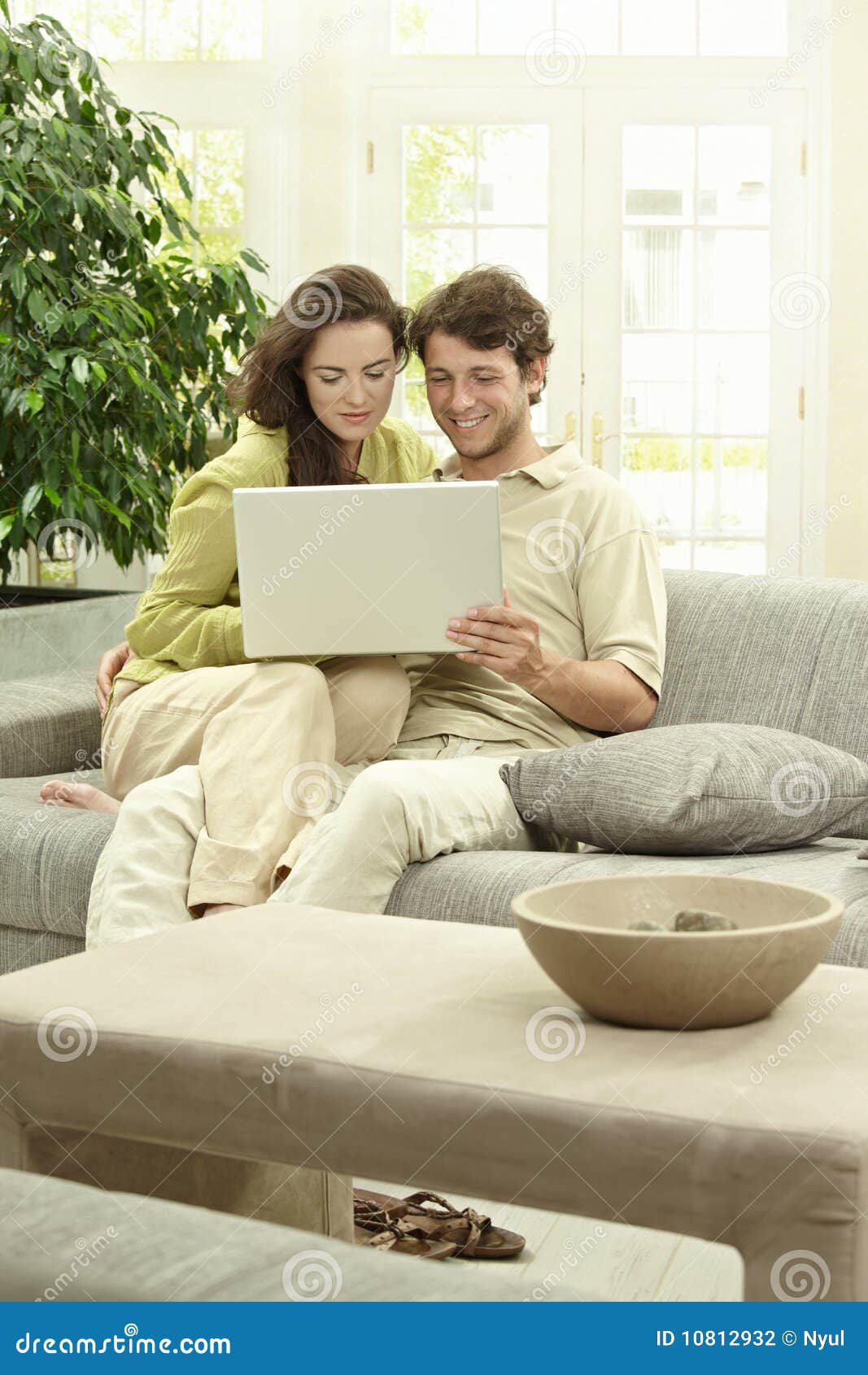 Couple using laptop stock photo. Image of jeans, browsing - 10812932