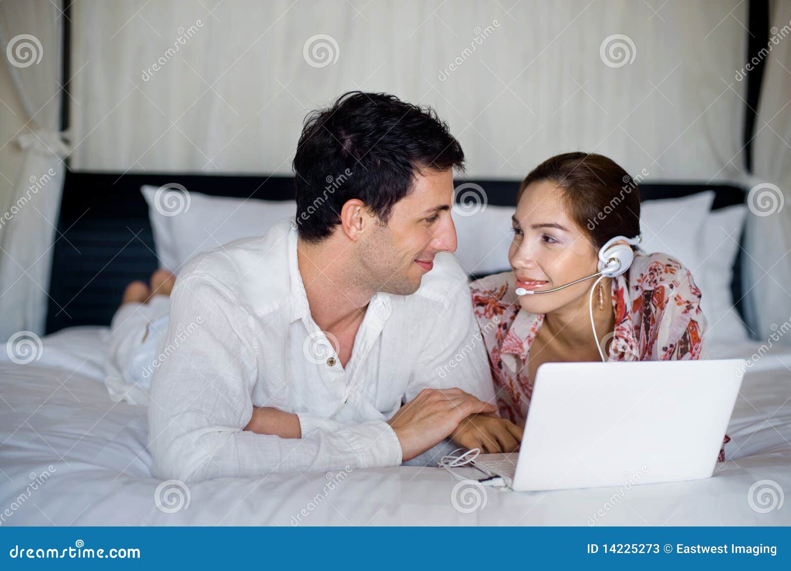 Couple Using Laptop stock image. Image of call, attractive - 14225273