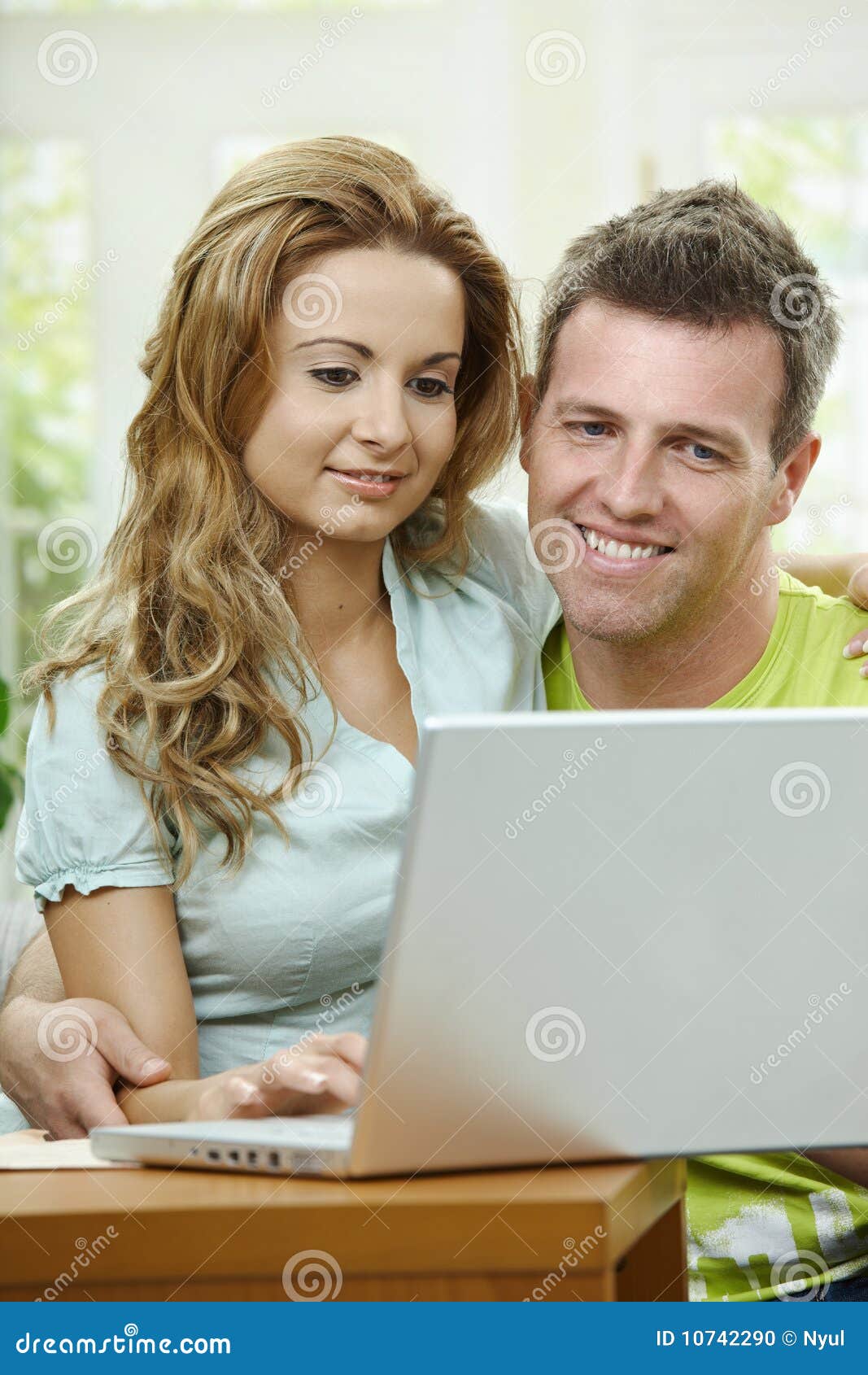 Couple Using Laptop Computer Stock Photo - Image of internet, furniture ...