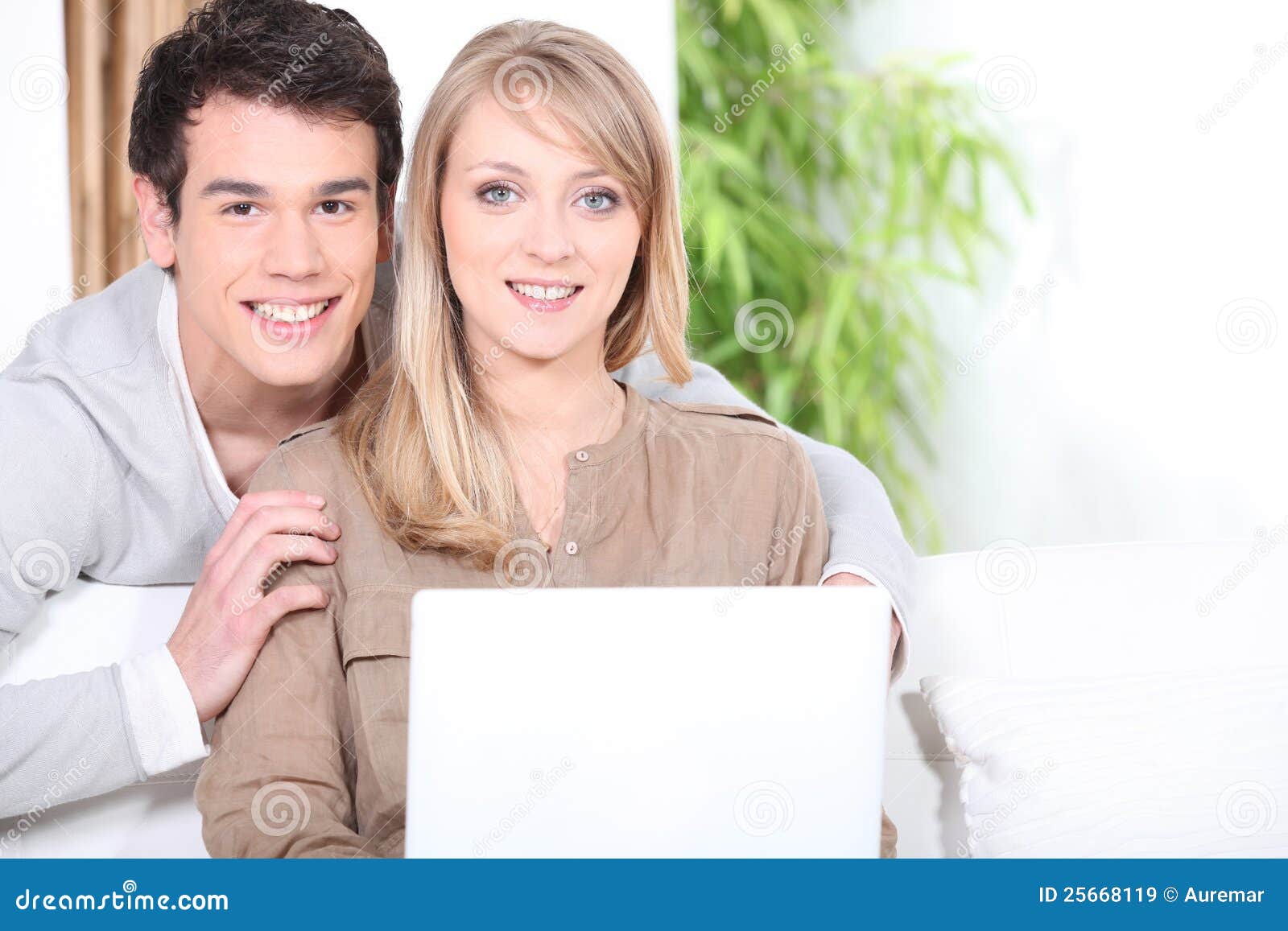Couple Using a Laptop Computer Stock Image - Image of hugging, laptop ...
