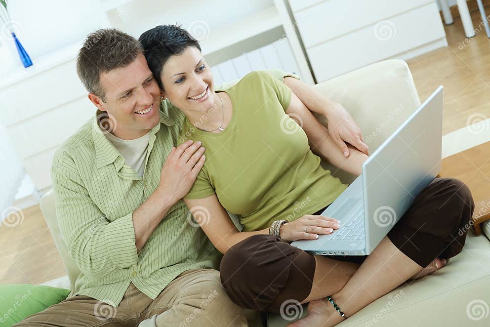 Couple Using Laptop at Home Stock Image - Image of face, lifestyle ...