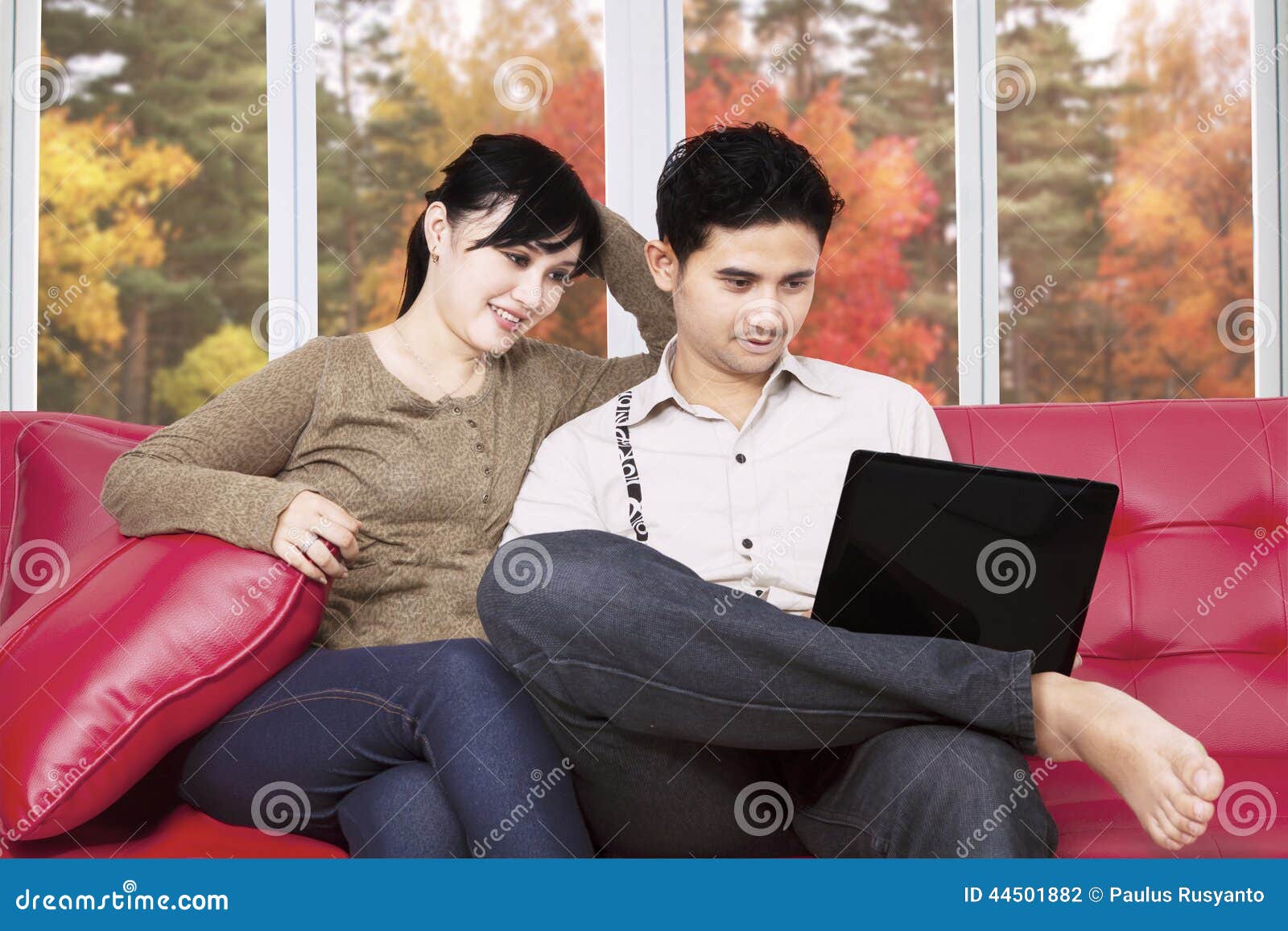 Couple Using Laptop at Home in Autumn Stock Photo - Image of cheerful ...