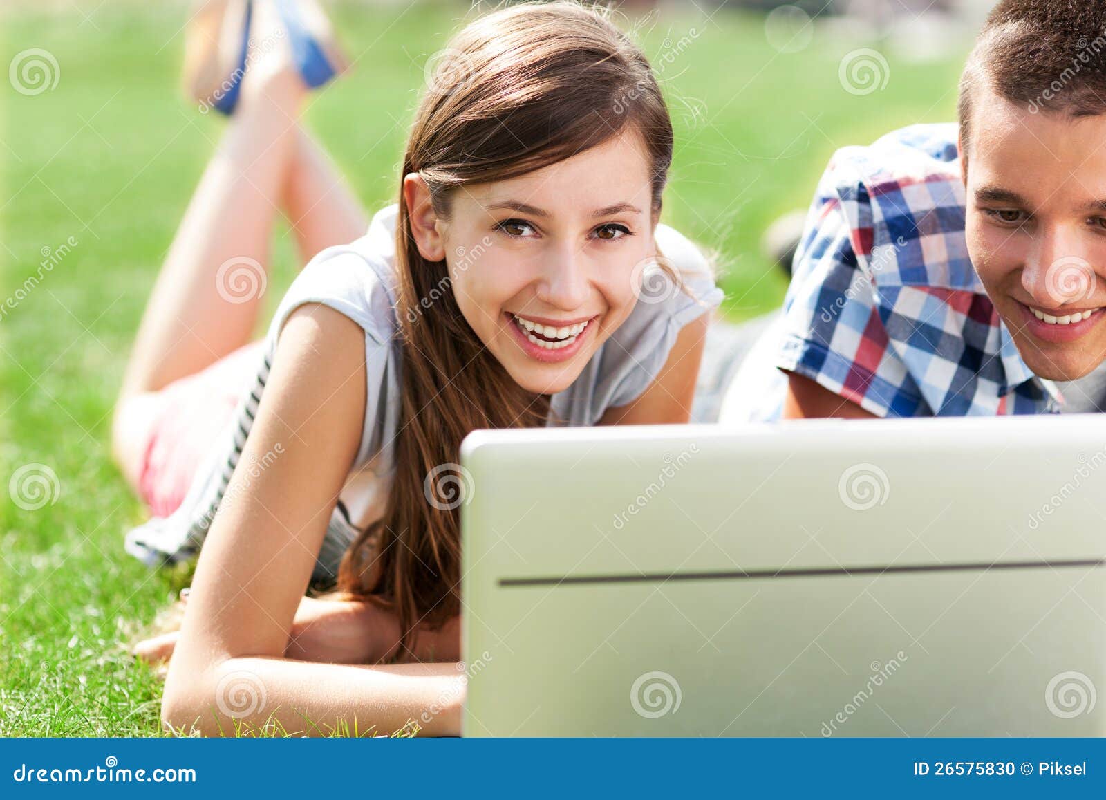 Couple Using Laptop Outdoors Stock Photo - Image of smile, enjoying ...