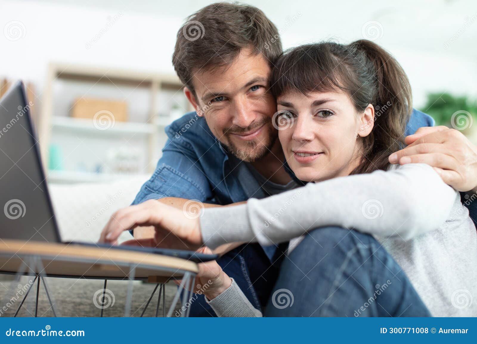 Couple Using Laptop while Sitting on Floor Stock Photo - Image of ...