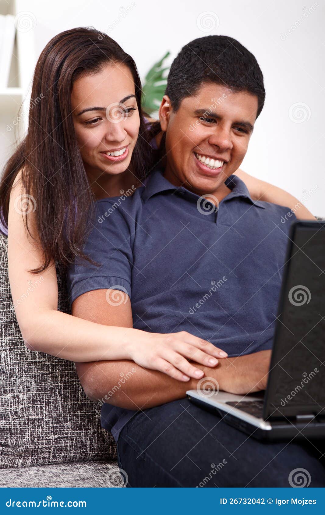 Couple Using a Laptop and Smiling Stock Photo - Image of happiness ...