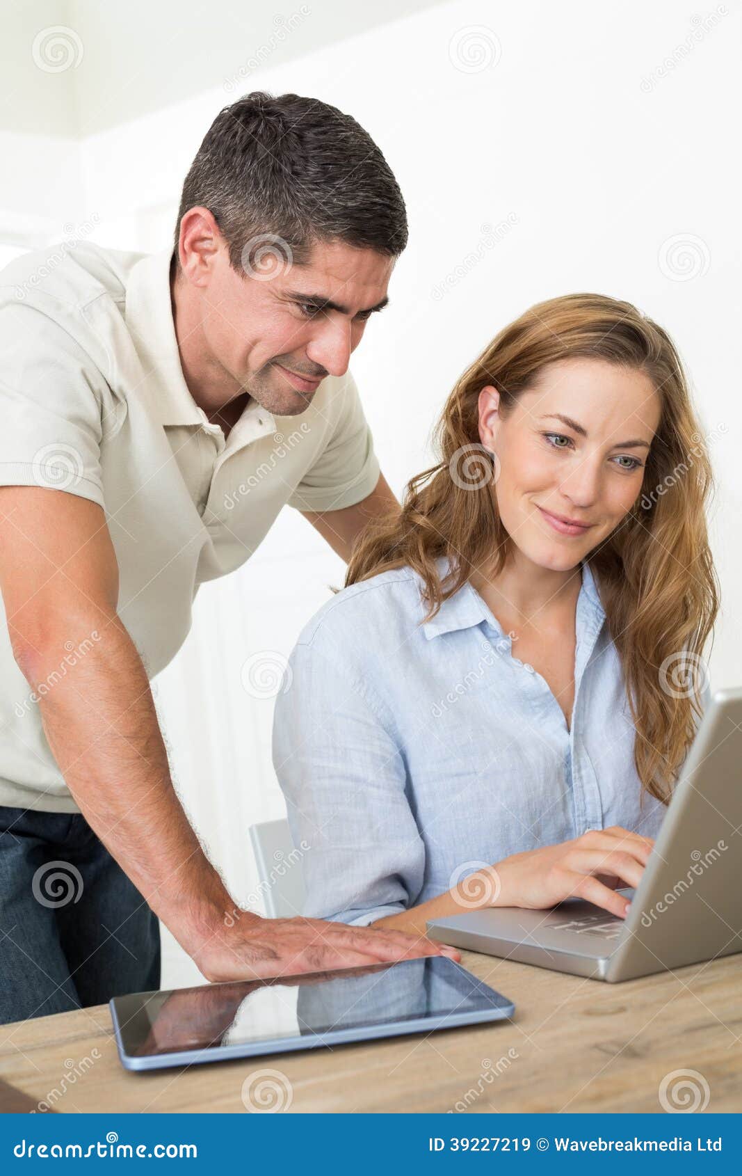 Couple Using Laptop at Table Stock Image - Image of leisure, laptop ...