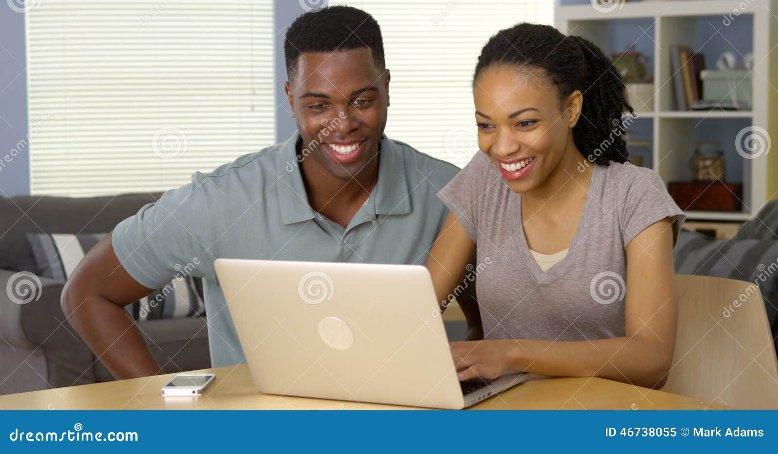 Couple Using Laptop Together at Desk Stock Image - Image of looking ...