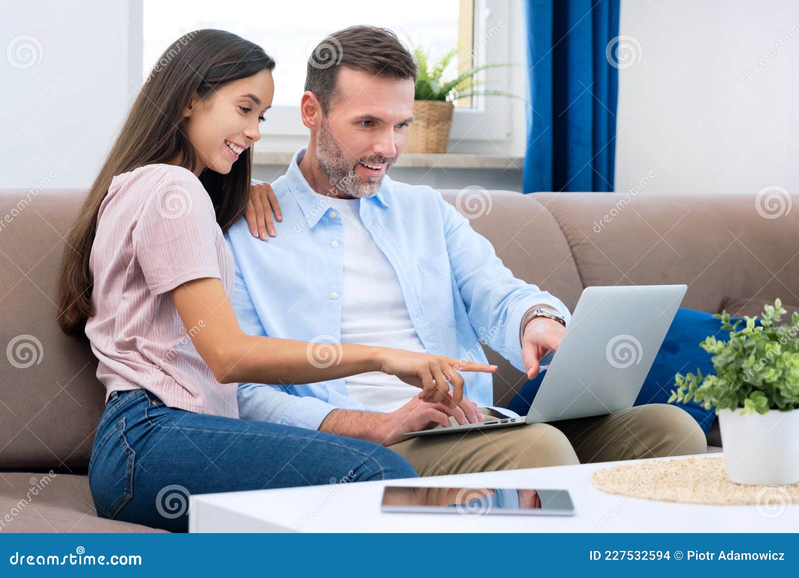 Couple Using Laptop, Watching Movie, Browsing Web Stock Photo - Image ...