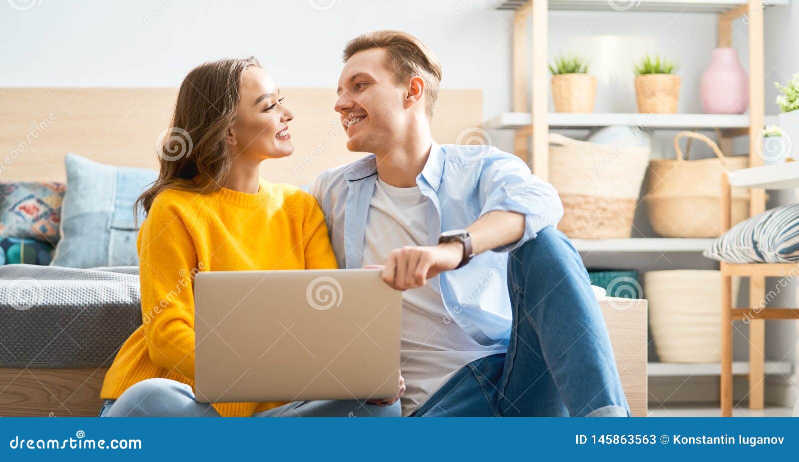 Couple is using a laptop stock image. Image of lifestyle - 145863563