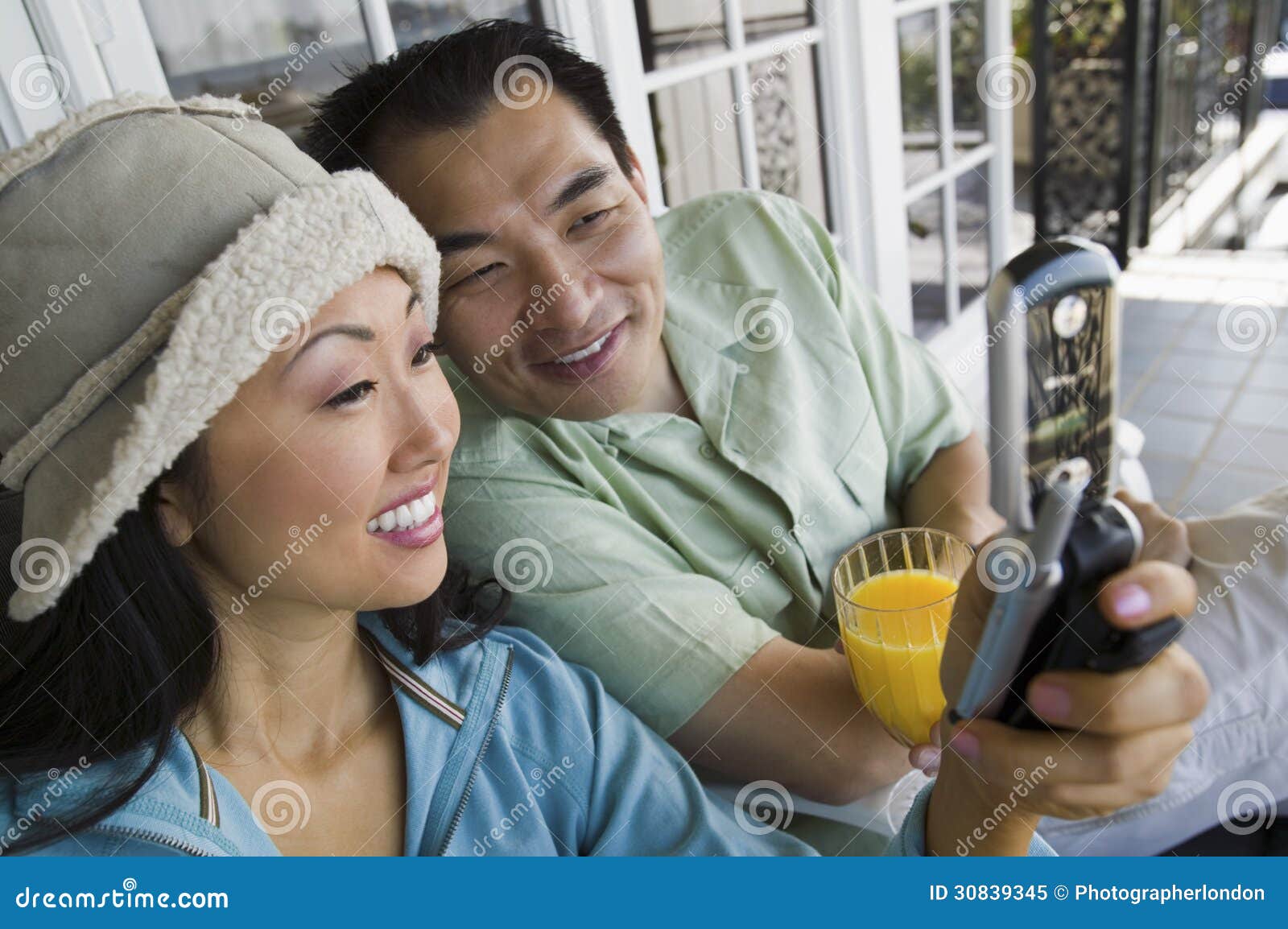 Couple Using Mobile Phone on Porch Stock Image - Image of enjoyment ...