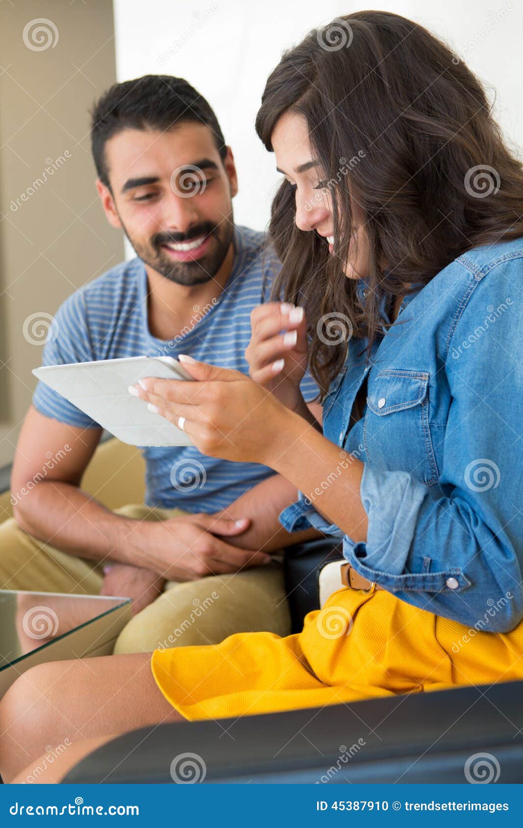Couple using tablet stock photo. Image of friends, looking - 45387910