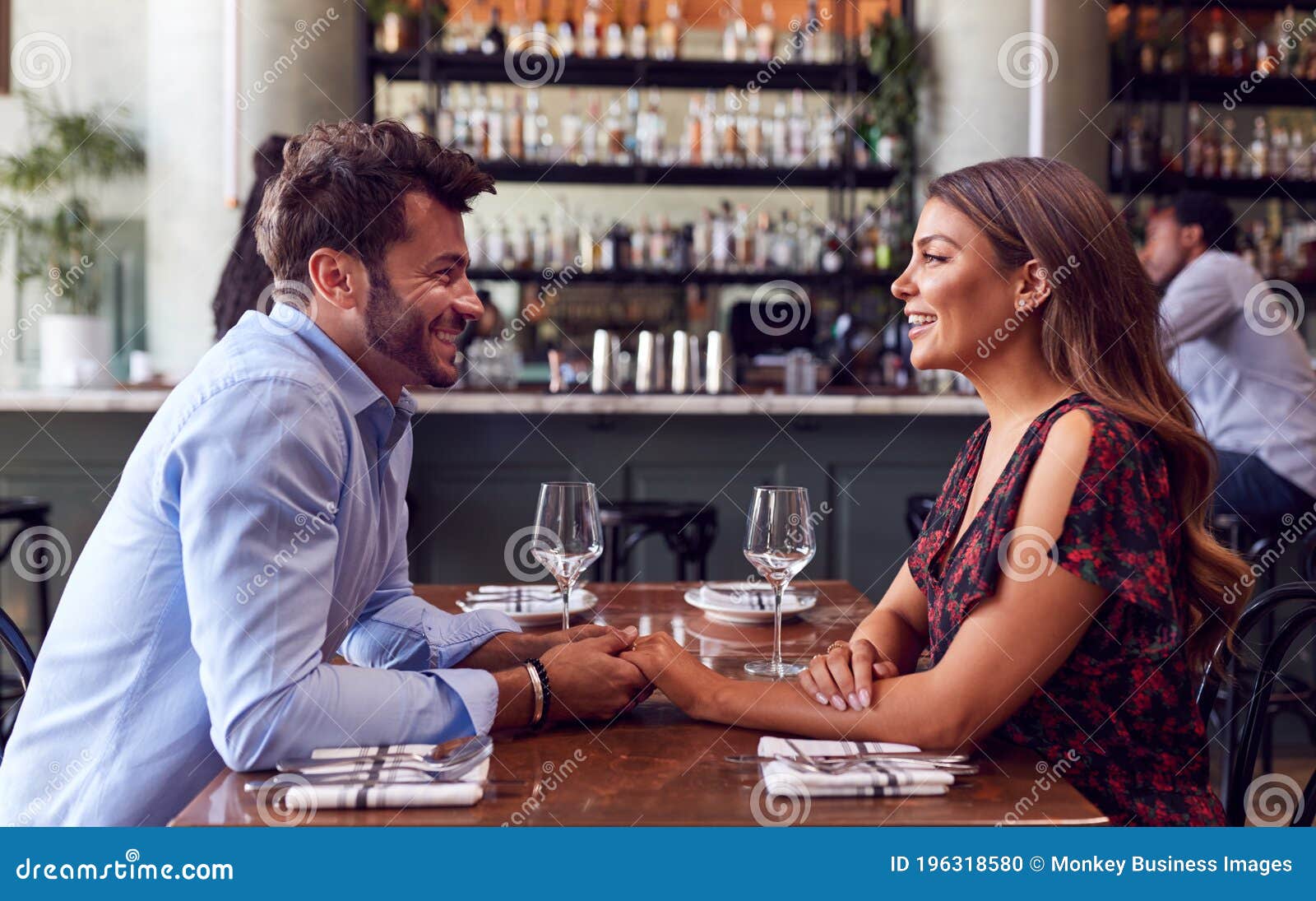 Couple on Valentines Day First Date Sitting at Table in Restaurant ...