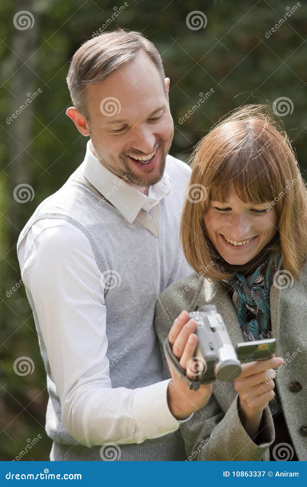 Couple with video camera stock image. Image of movie - 10863337