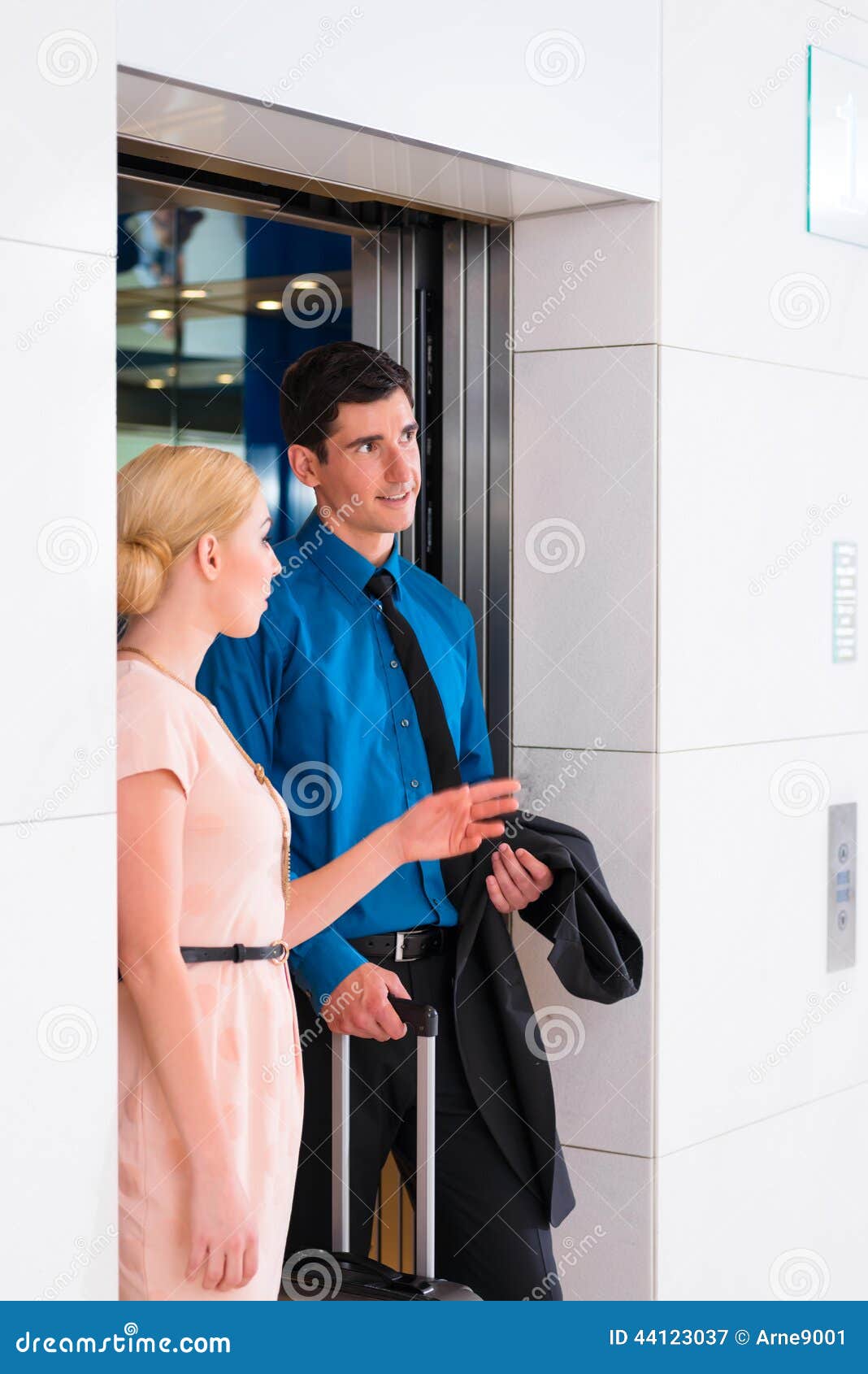 Couple Waiting for Hotel Elevator Stock Image - Image of driving ...