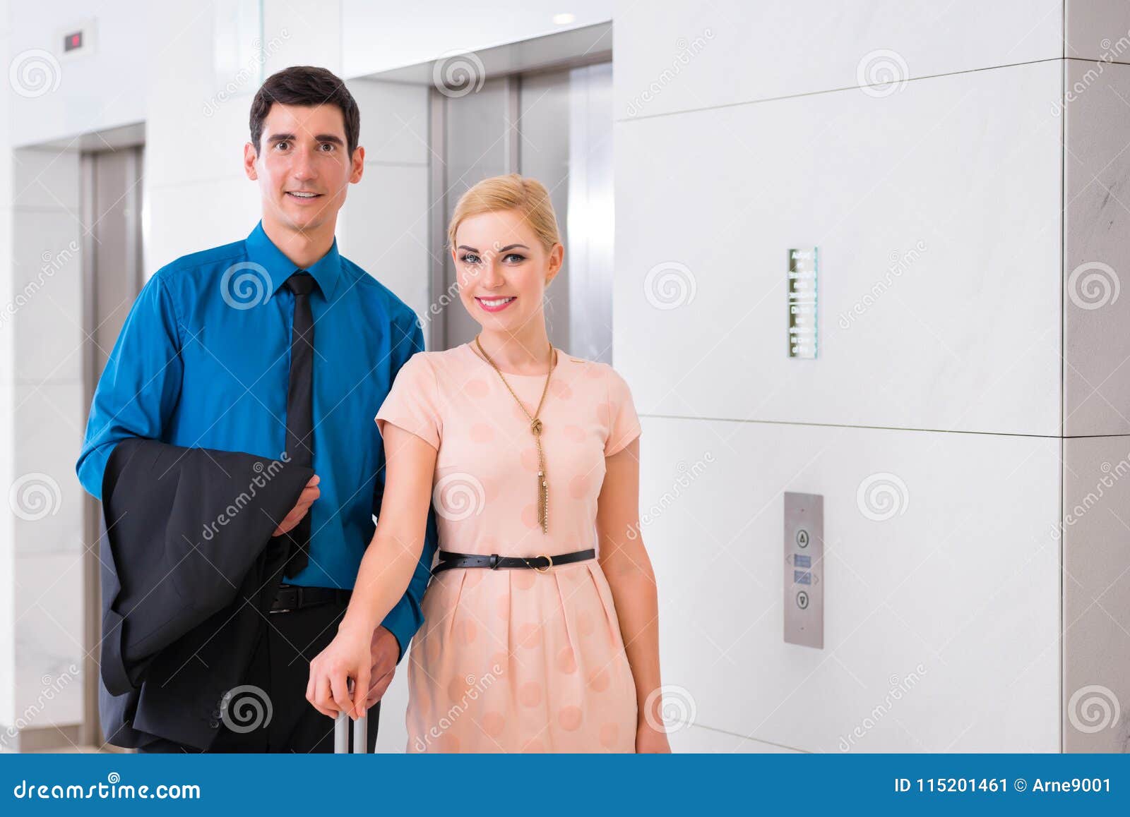 Couple Waiting for Hotel Elevator or Lift Stock Image - Image of ...