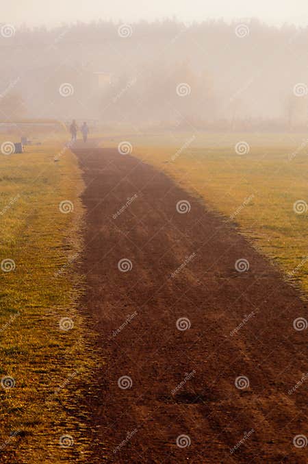 Couple walk in the mist stock image. Image of nature - 22176385